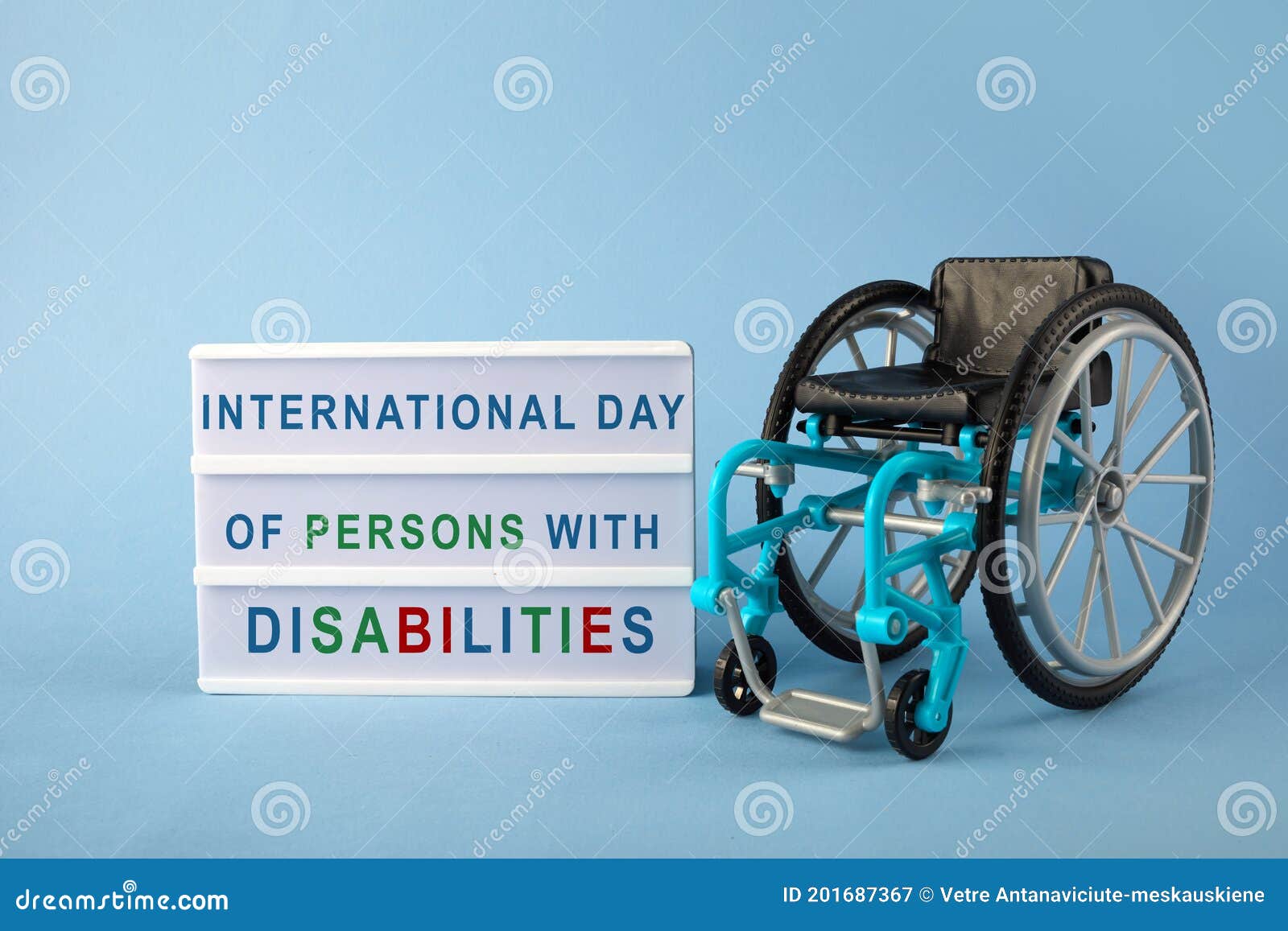 International Day of Persons with Disabilities. Wheelchair on Blue ...