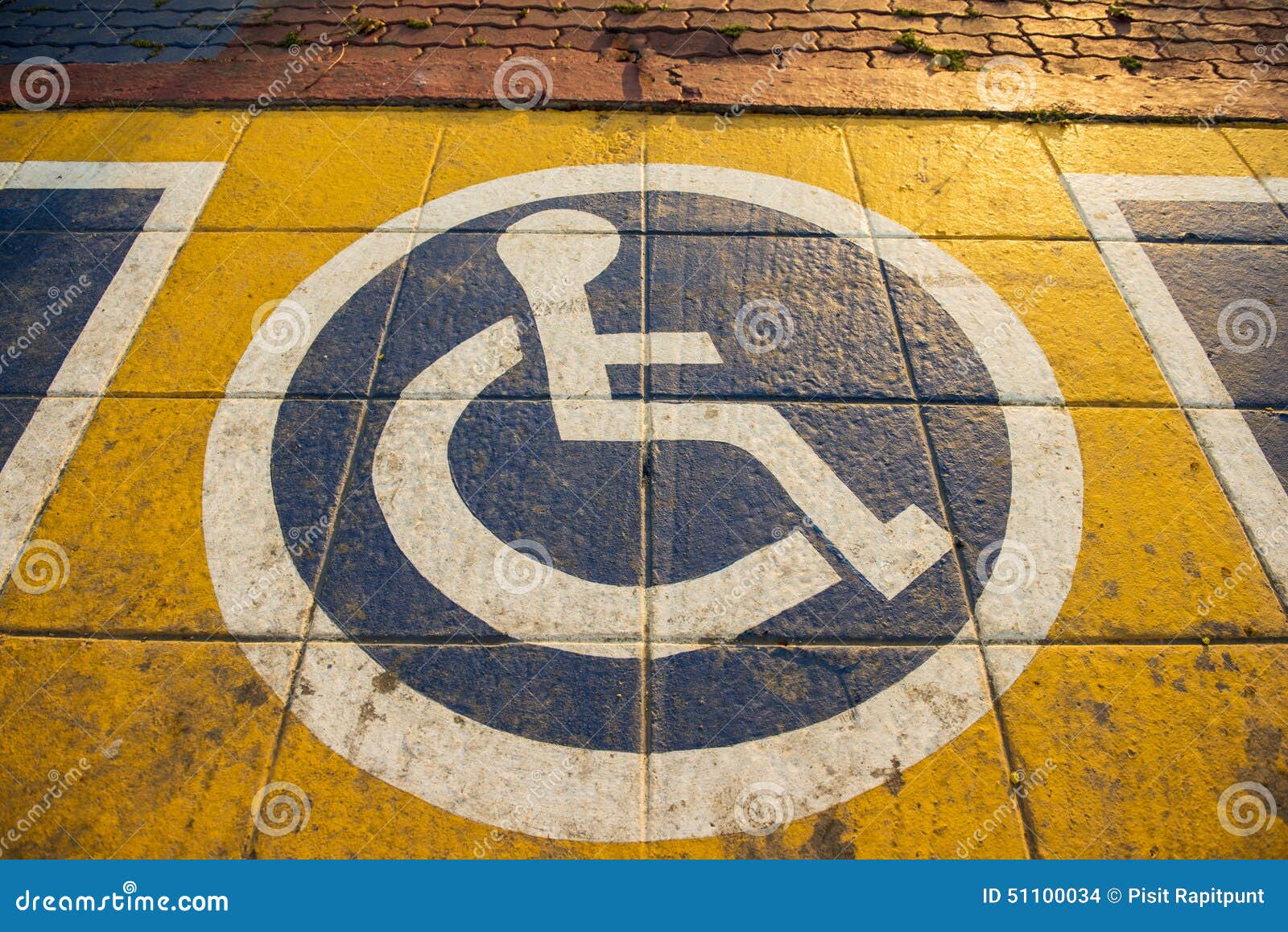 International Handicapped Symbol Painted on Walking Path in the Park ...