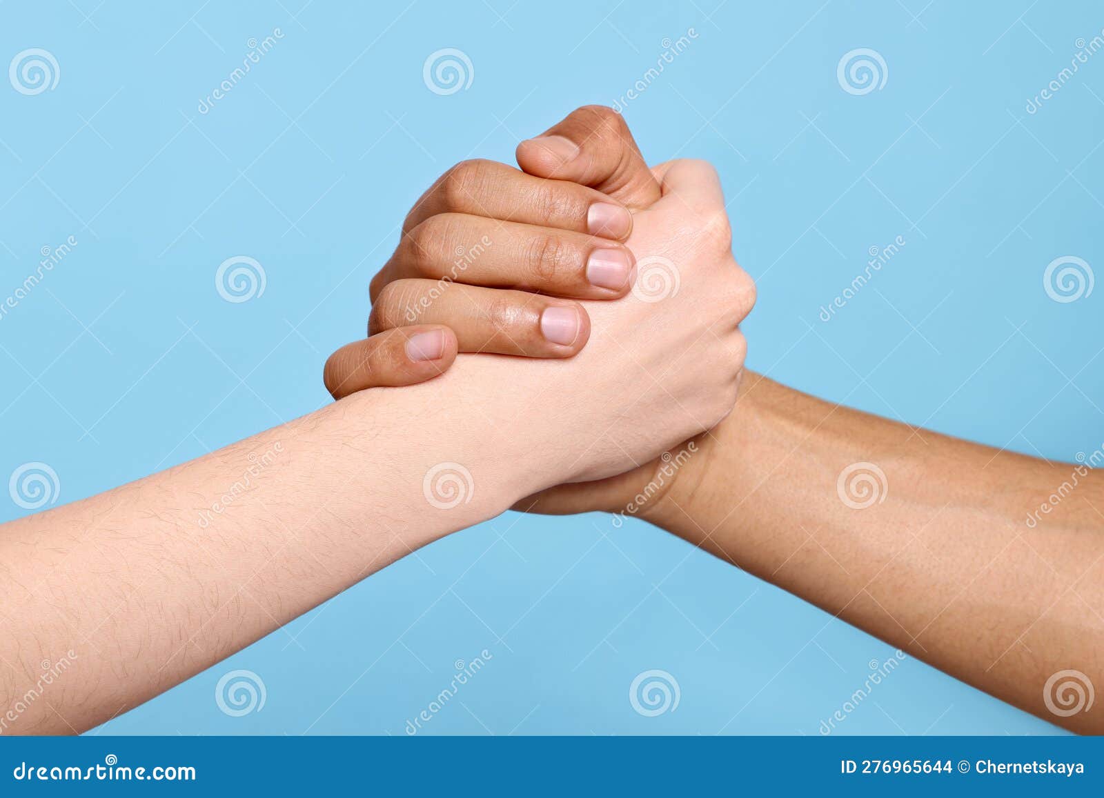 International Relationships. People Clasping Hands on Light Blue ...