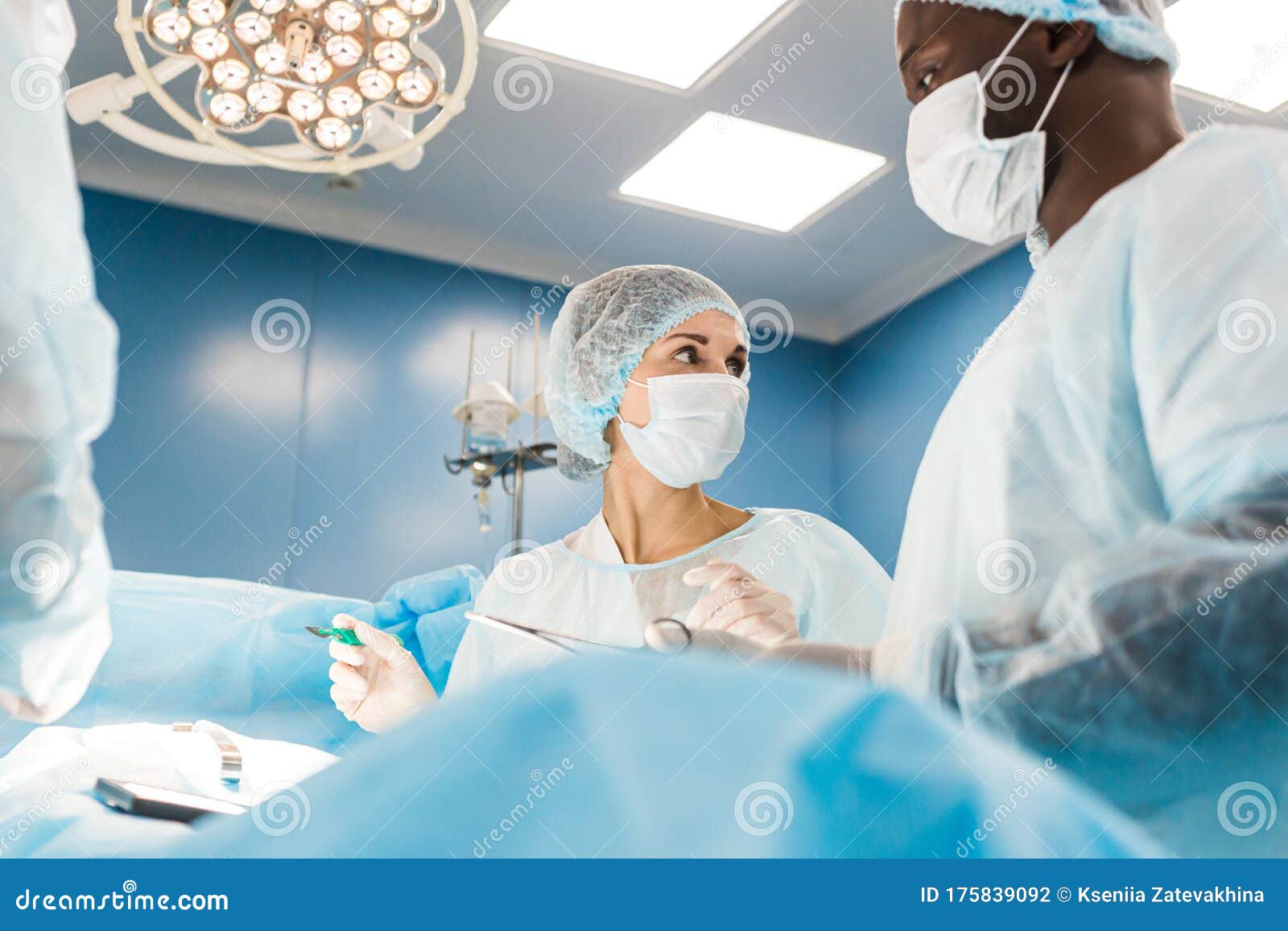 An International Team of Doctors Performs a Complex Surgical Operation ...