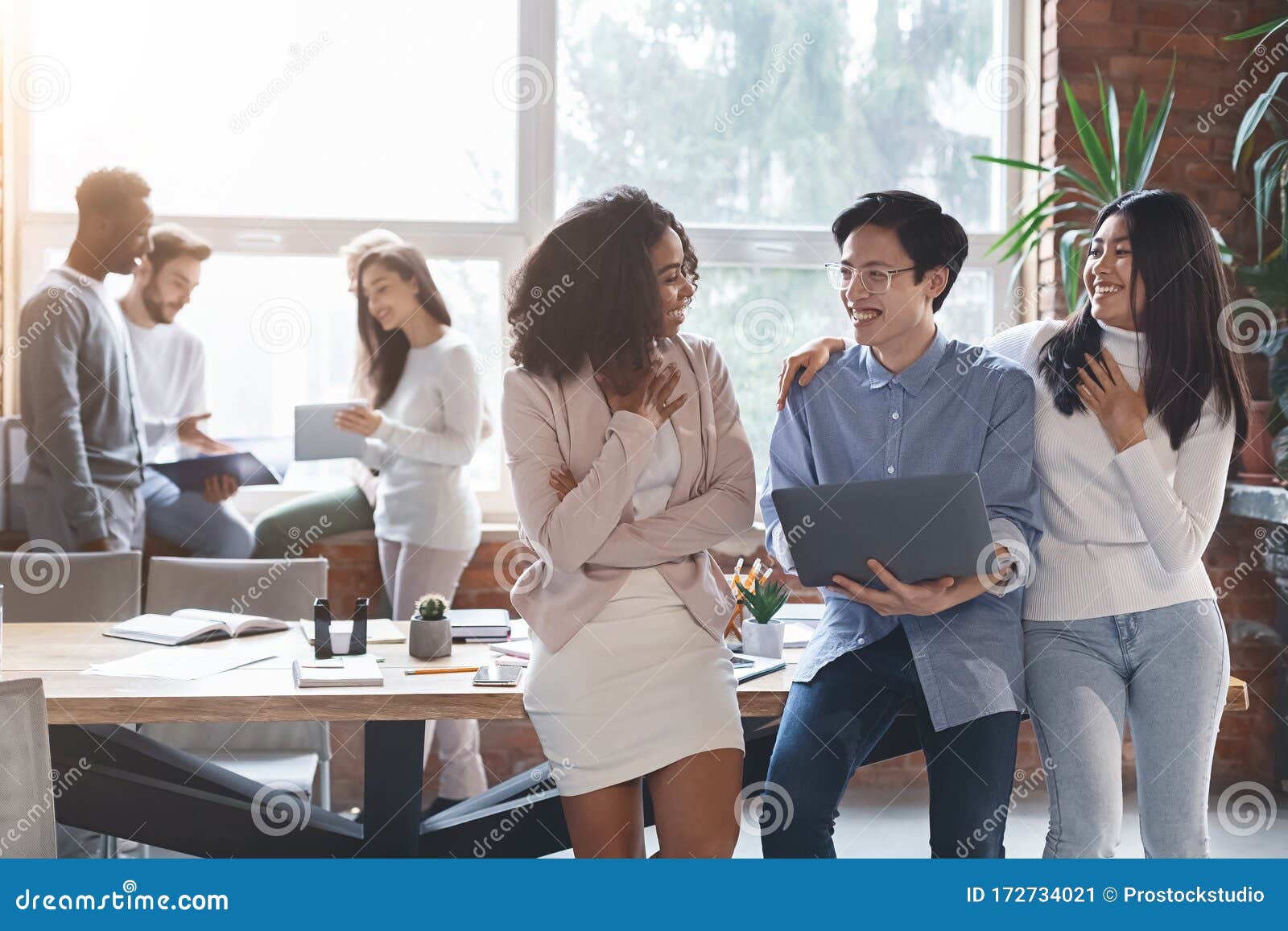 International Young Colleagues Sharing Creative Ideas during Break ...