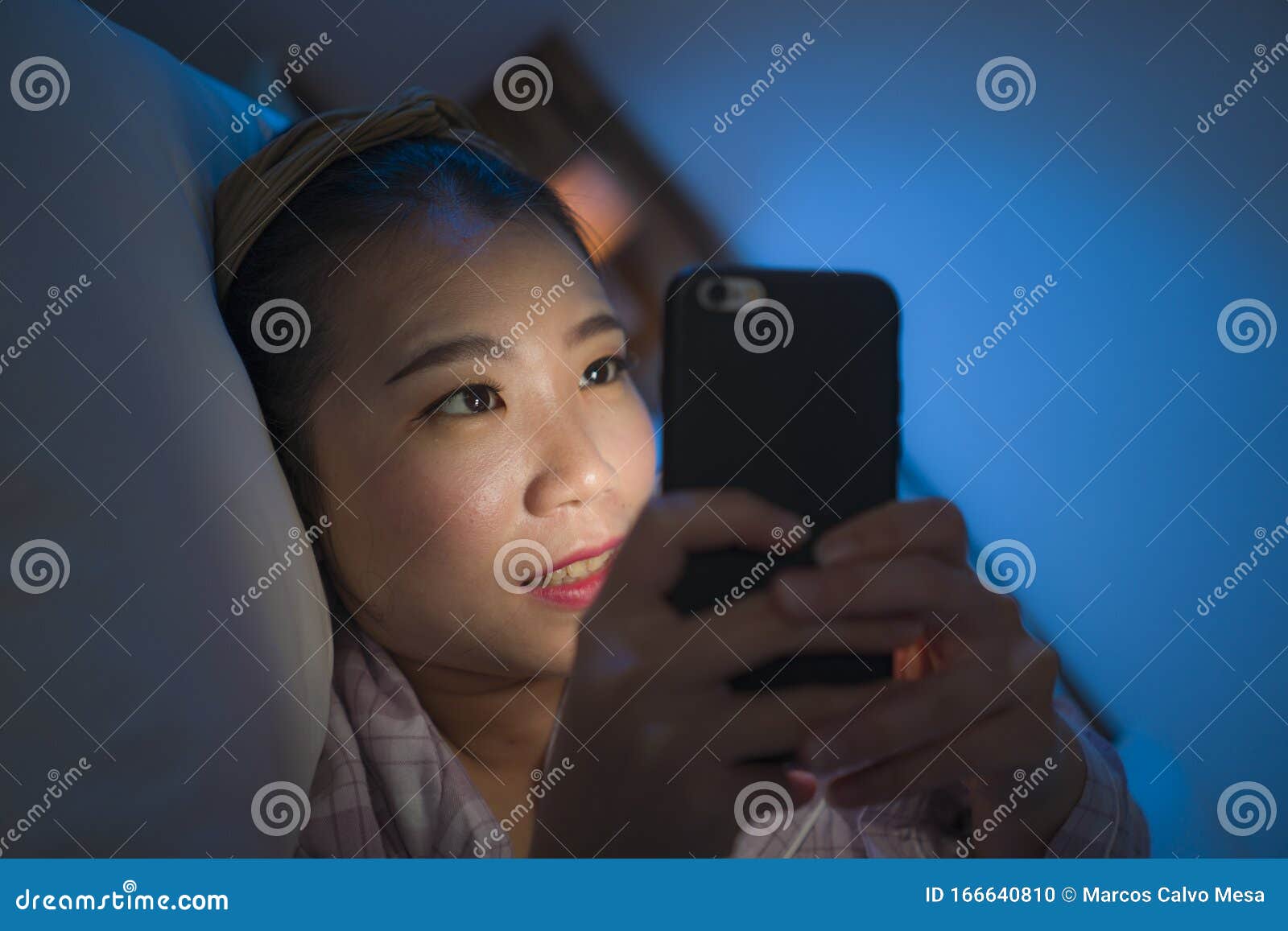 Internet Addict Asian Girl Mesmerized With Hand Phone Young Beautiful Korean Woman In Pajamas 4400