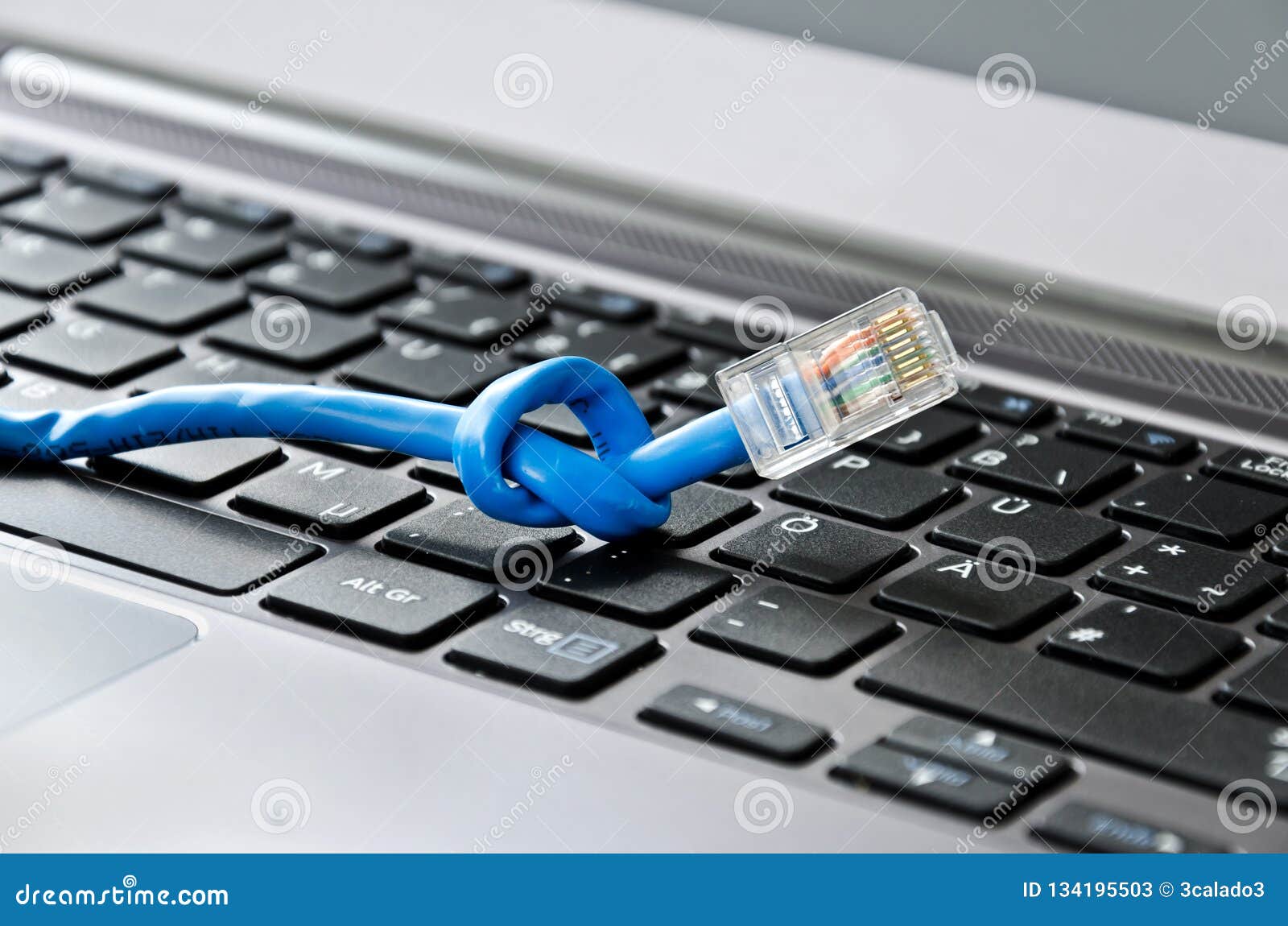 Internet Cable Tied into Knot Lying on Computer Keyboard Symbolizing ...