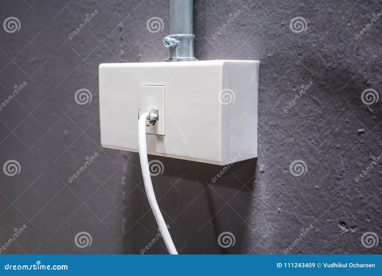 Internet Cable with White Network Outlet Against Grey Concrete Stock ...