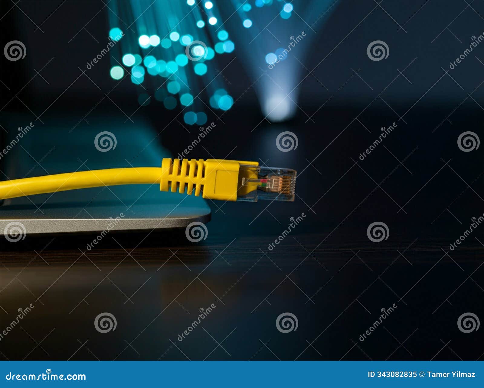 Internet Connection Cable on Laptop on Table, Unfocused Fiber Optic ...