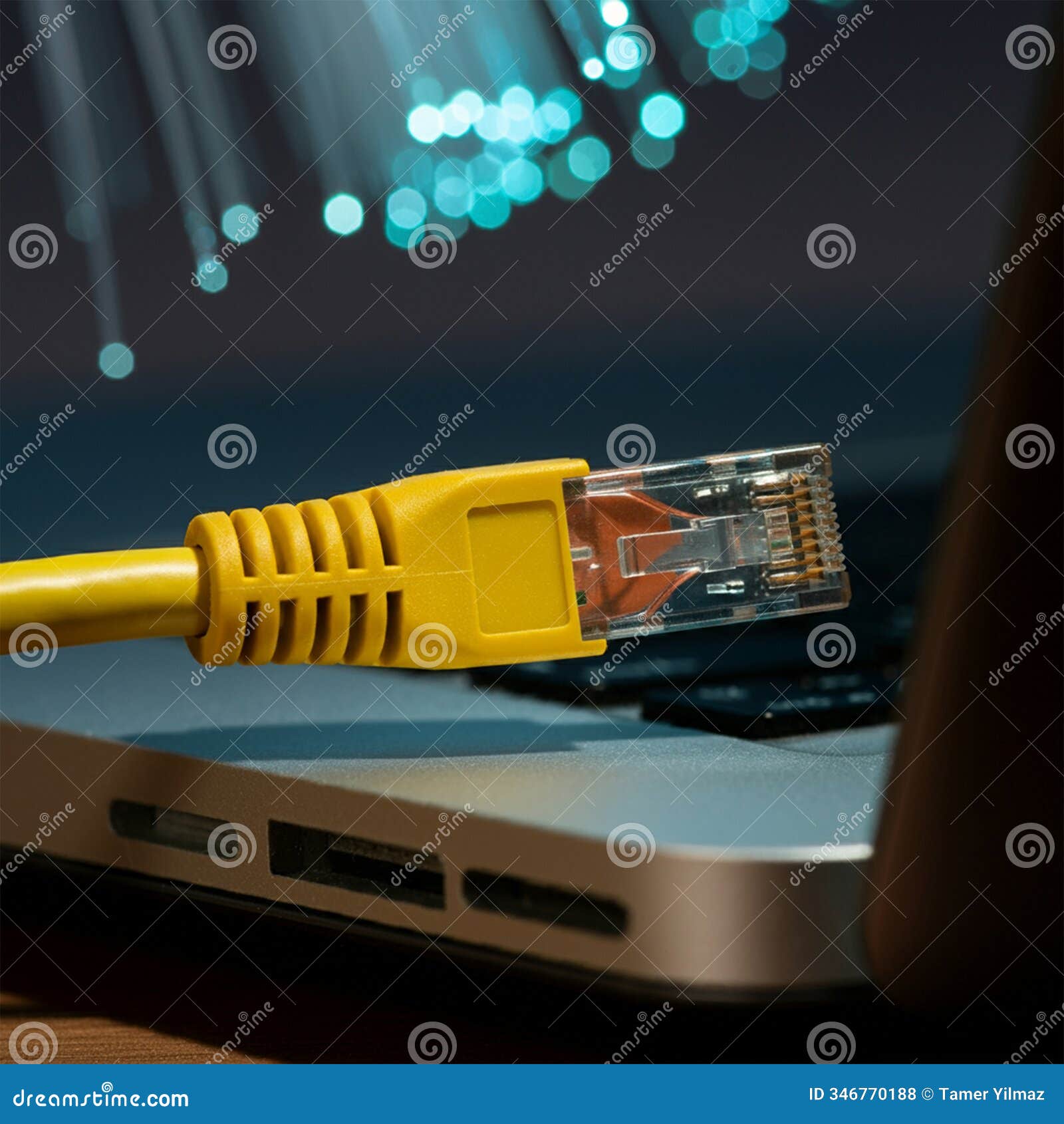 Internet Connection Cable on Laptop on Table, Unfocused Fiber Optic ...