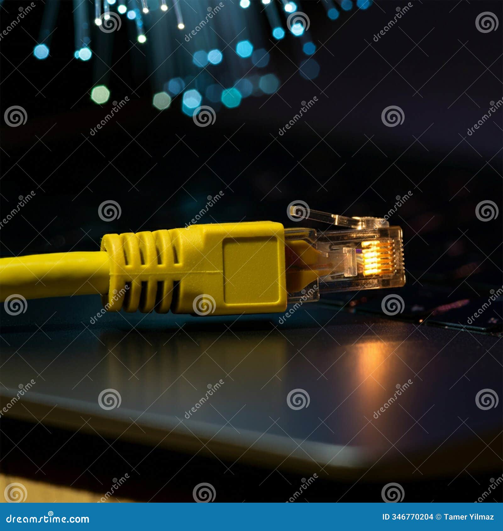 Internet Connection Cable on Laptop on Table, Unfocused Fiber Optic ...