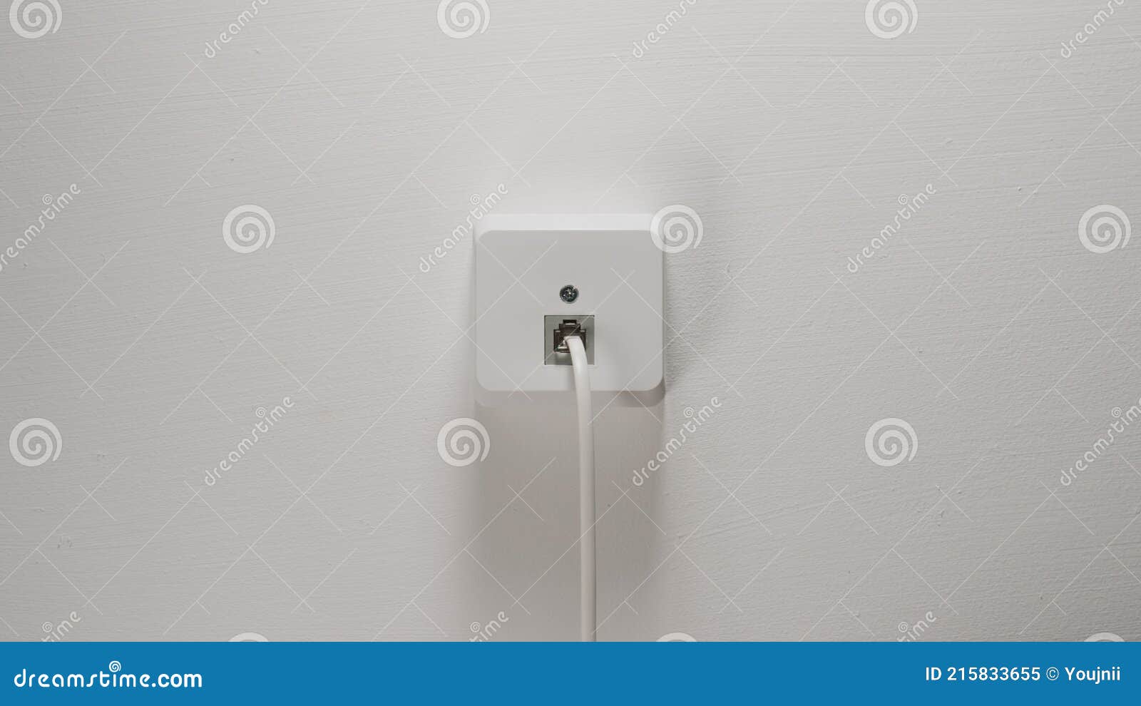 Internet Cord into Wall Socket on a White Wall Stock Image - Image of ...