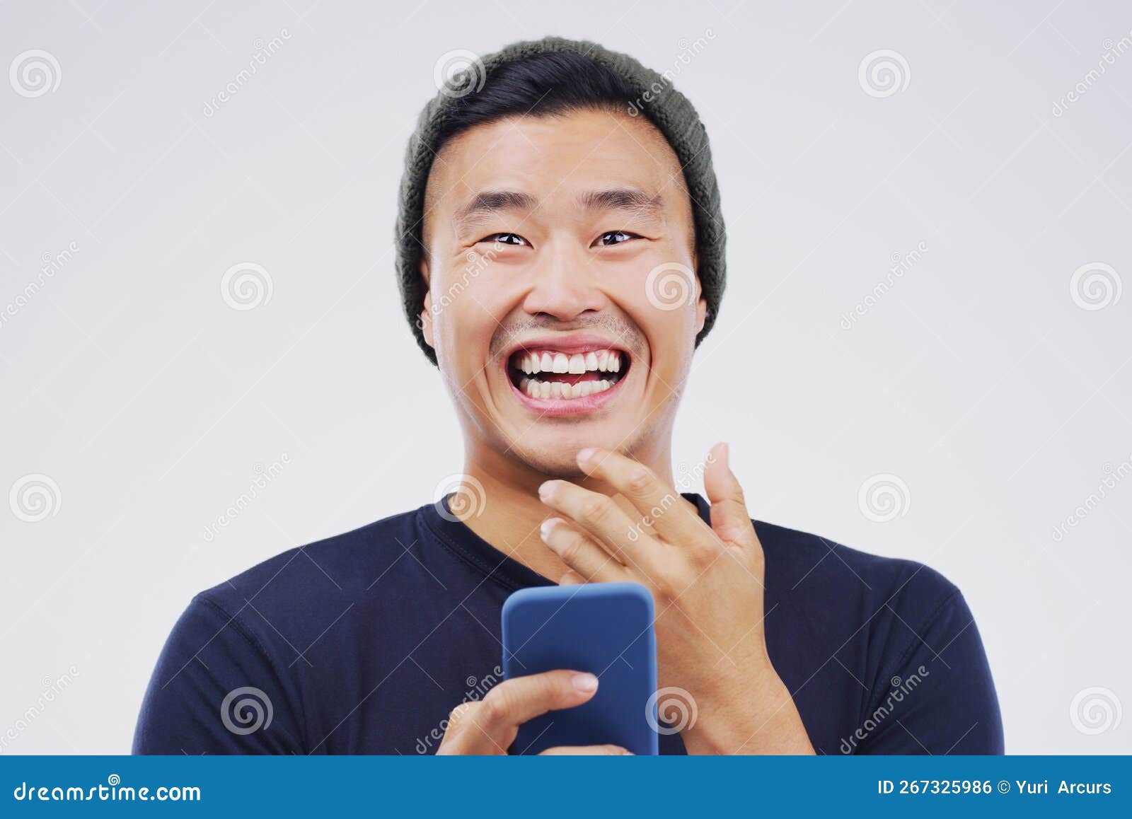 The Internet is Pure Entertainment. Studio Shot of a Man Laughing while ...