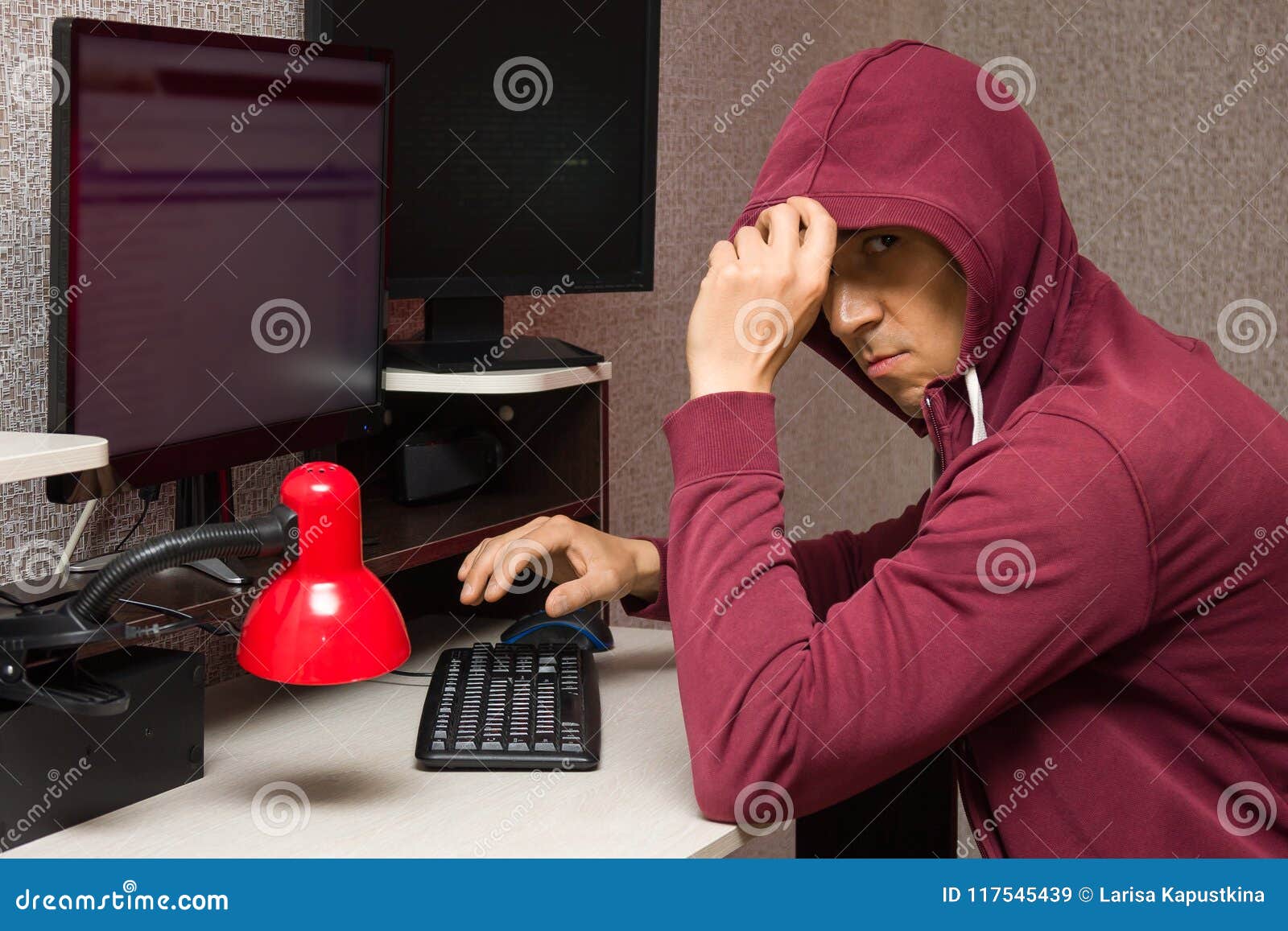 Internet Troll with the Evil Face Sitting at the Computer. Bad Man ...