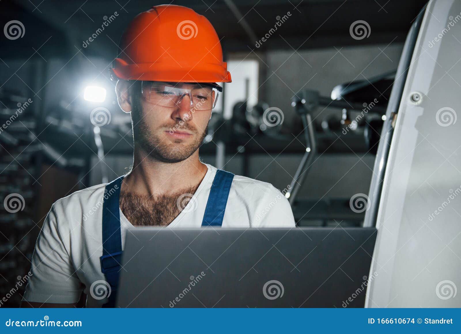 Internet, Wireless Technologies. Man in Uniform Works on the Production ...