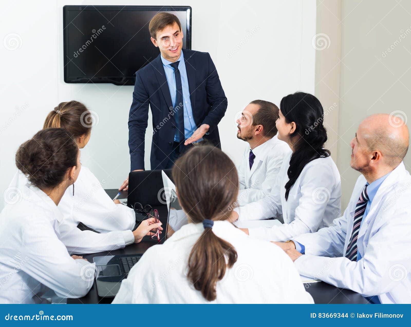Interns and Professor at Meeting Stock Photo - Image of asian, sitting ...