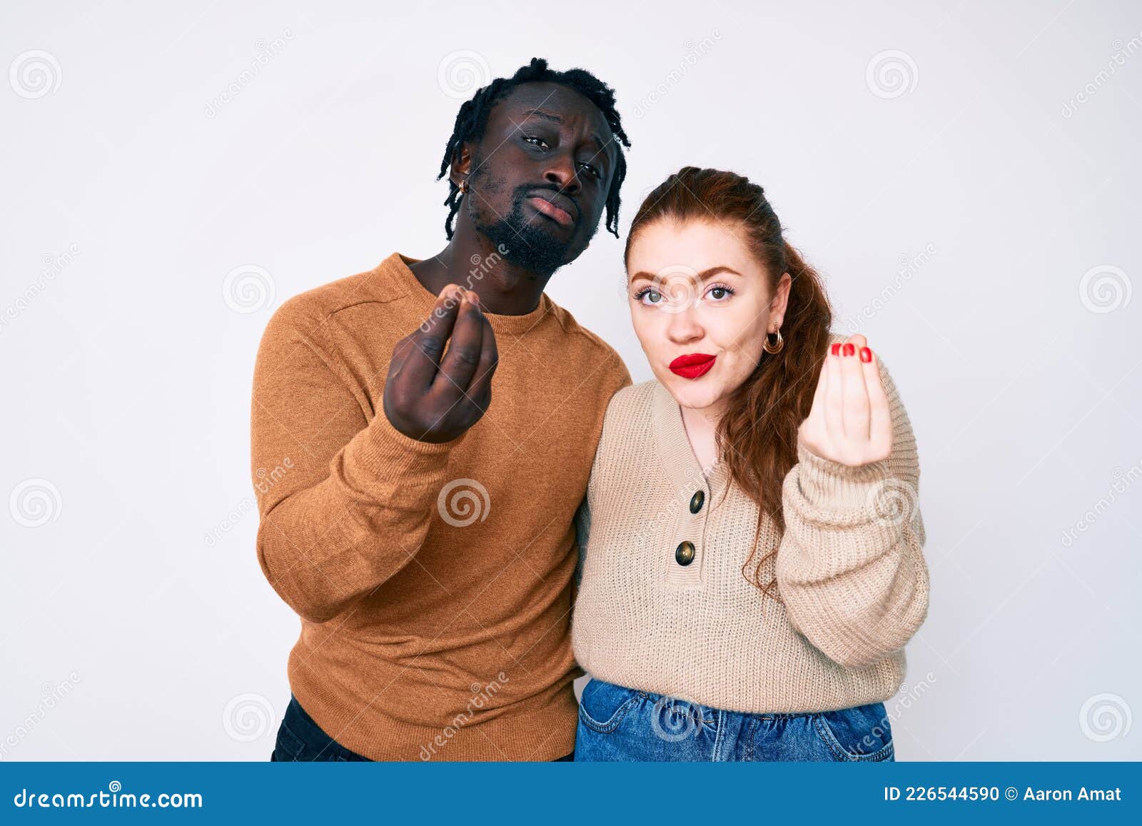 Interracial Couple Wearing Casual Clothes Doing Italian Gesture With