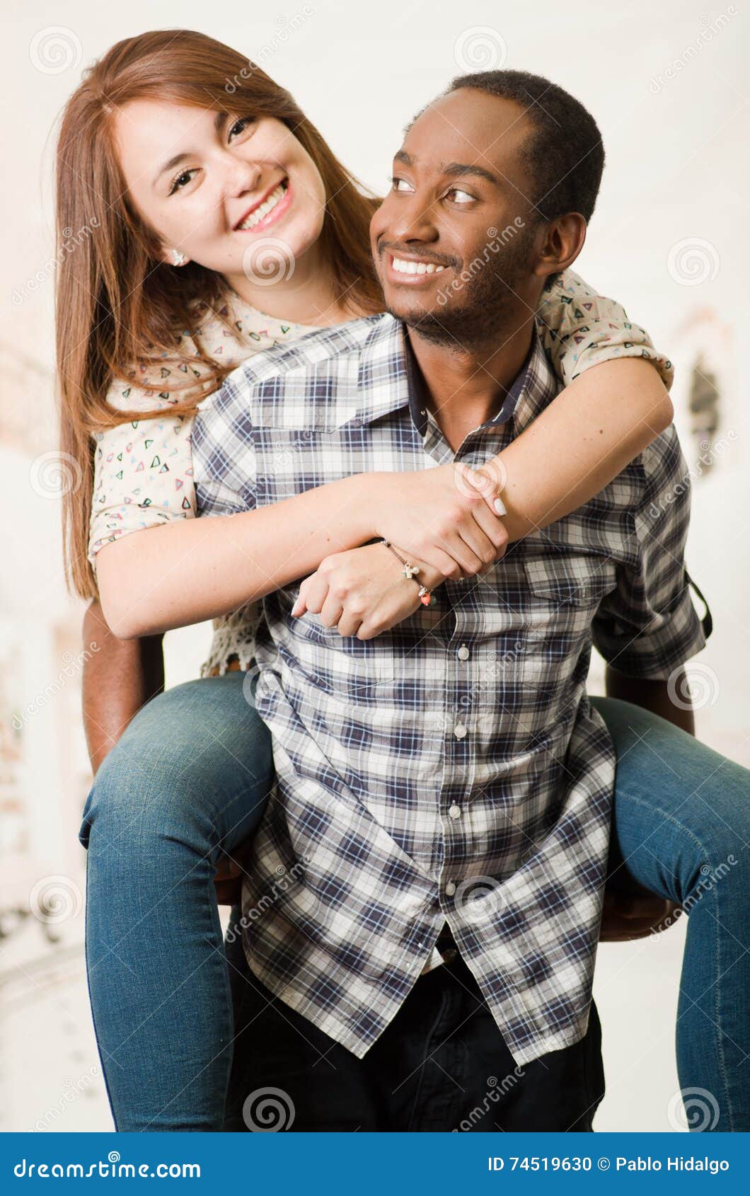 Interracial Couple Wearing Casual Clothes Interacting Having Fun Man