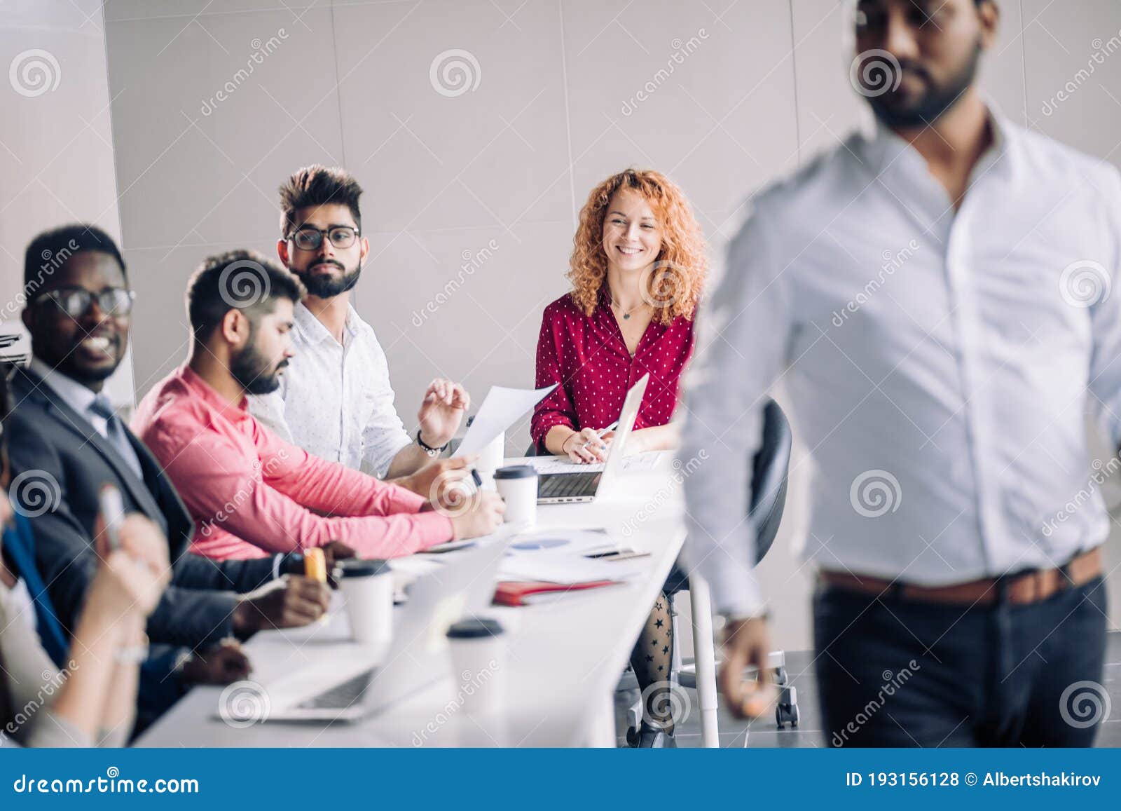 Mixed Race People Listening To Presentation Sitting in Row at Boardroom ...