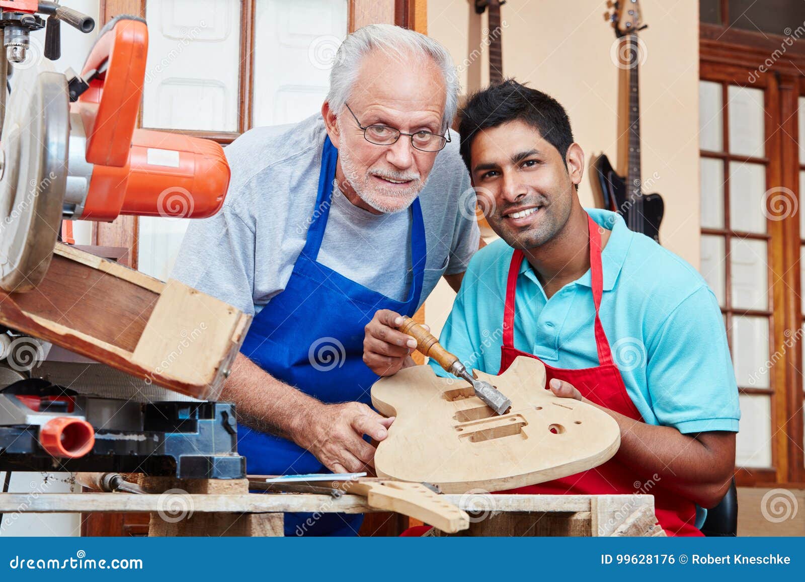 Interracial Luthier`s Apprentice and Master Stock Photo - Image of joiner, artisan: 99628176