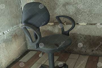 The Interrogation Chair. an Old Chair in a Concrete Basement Stock ...