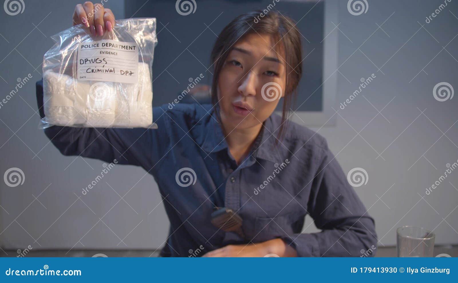 A Cop Shows a Package of Drugs As Evidence Stock Photo - Image of ...