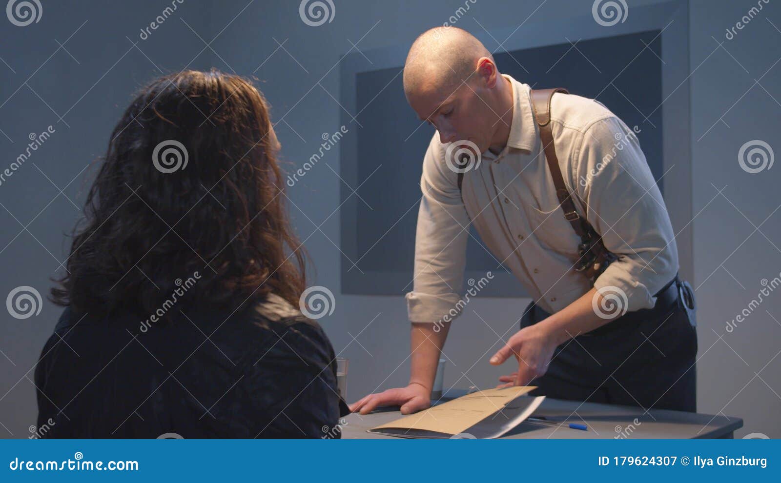 Interrogation of the Suspect. Serious Cop. Sliding Stock Image - Image ...