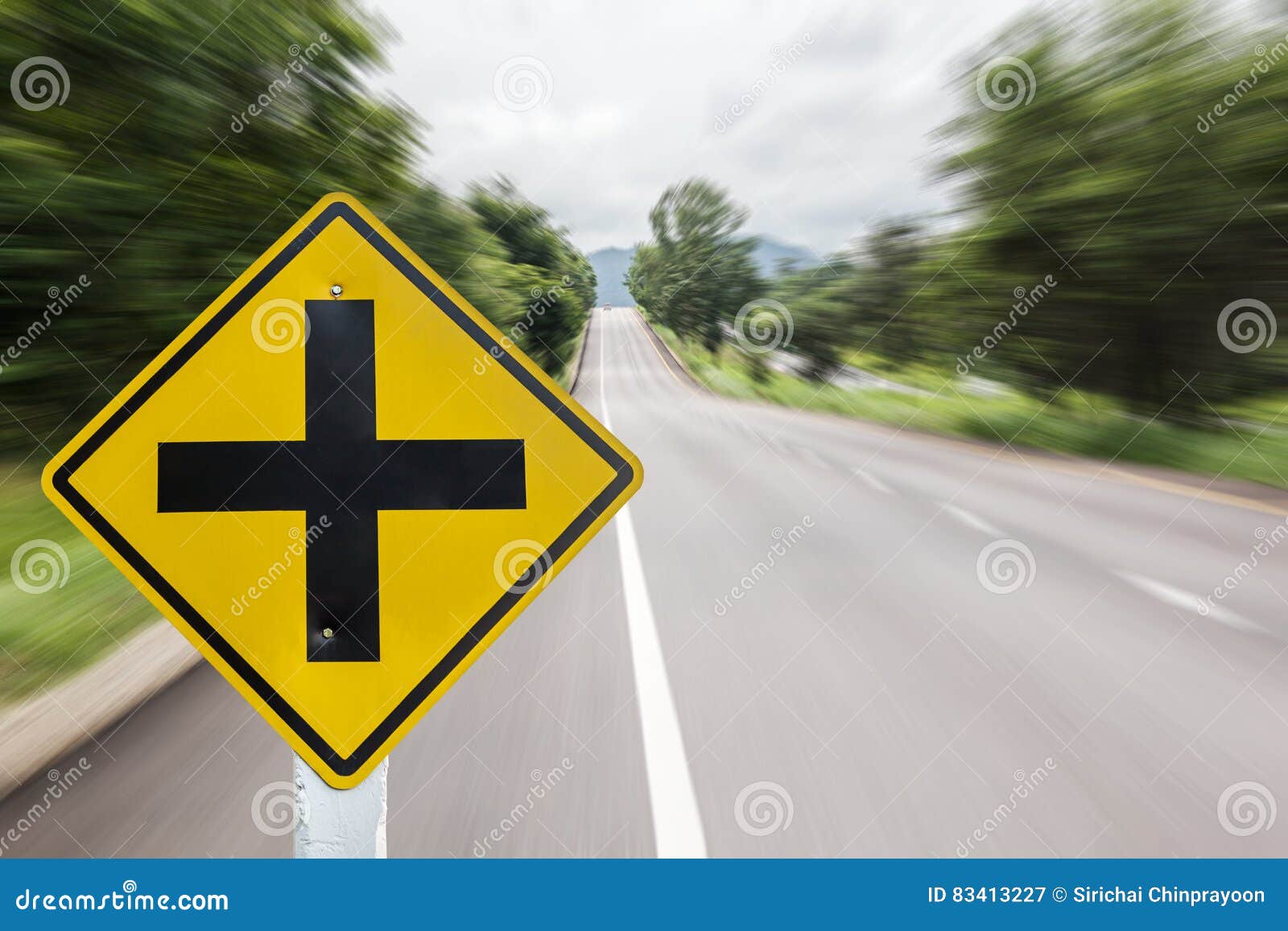 Intersection Ahead Sign on Blur Road Background Stock Image - Image of ...