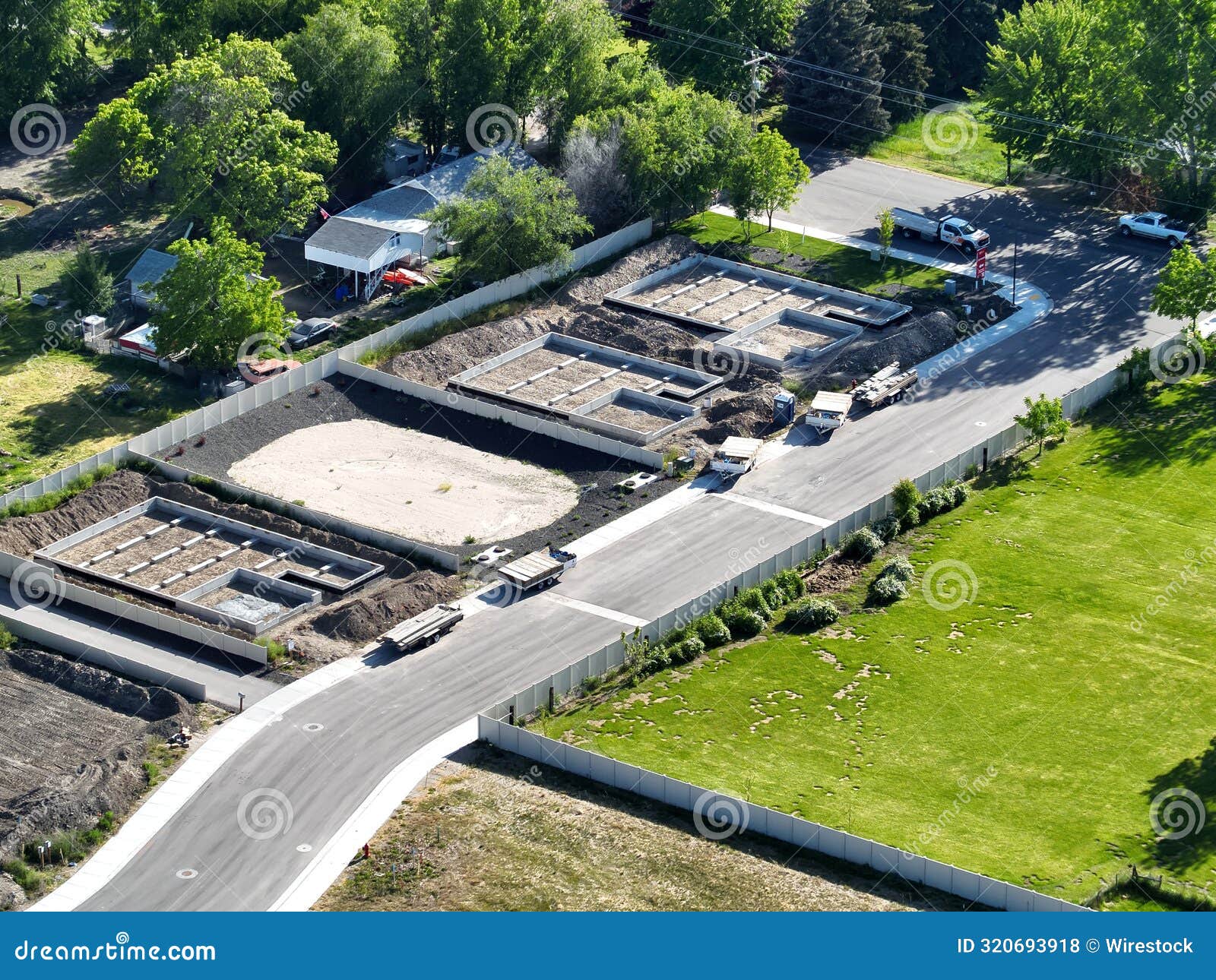 The Intersection is Being Built between Two Roads and an Open Parking ...