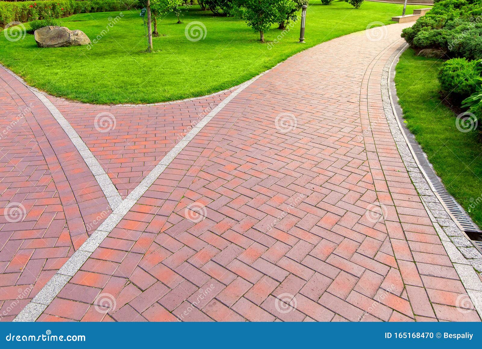 The Intersection of Footpaths of Red Tiles and a Drainage Grid in a ...