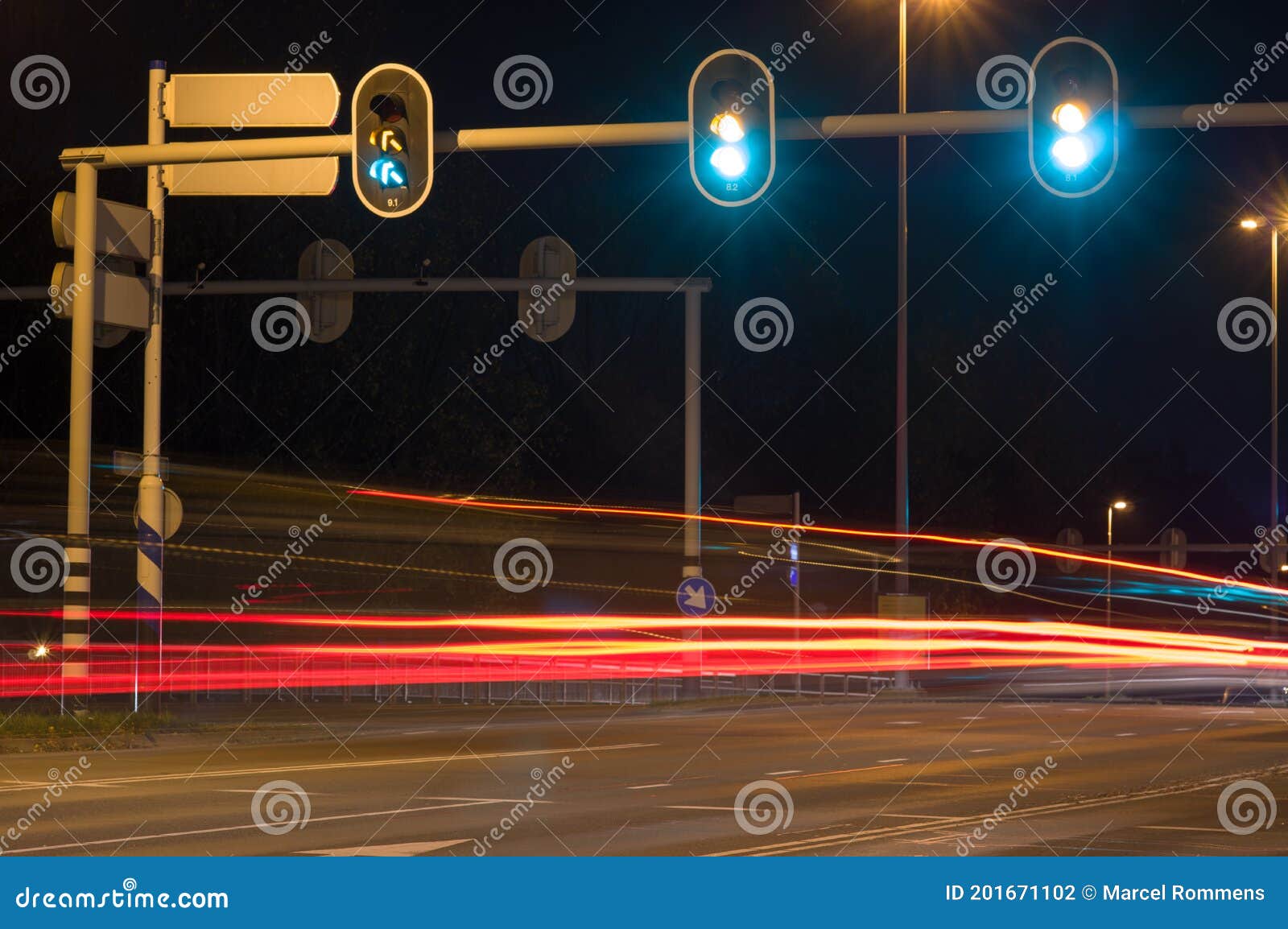 Intersection at Night with Traffic Lights and Traffic Stock Photo ...