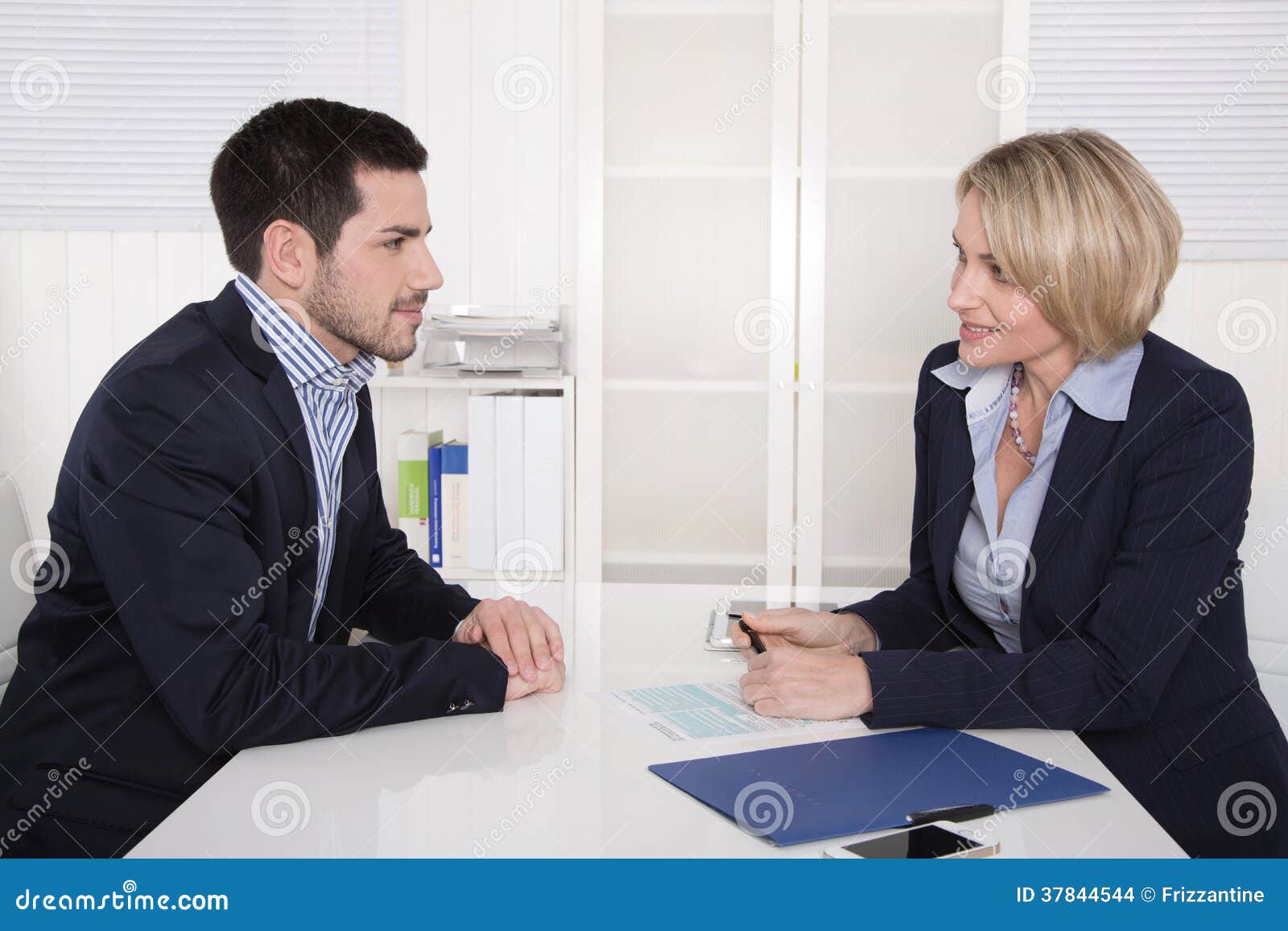 Interview with Manager and Young Attractive Man at Office. Stock Photo ...