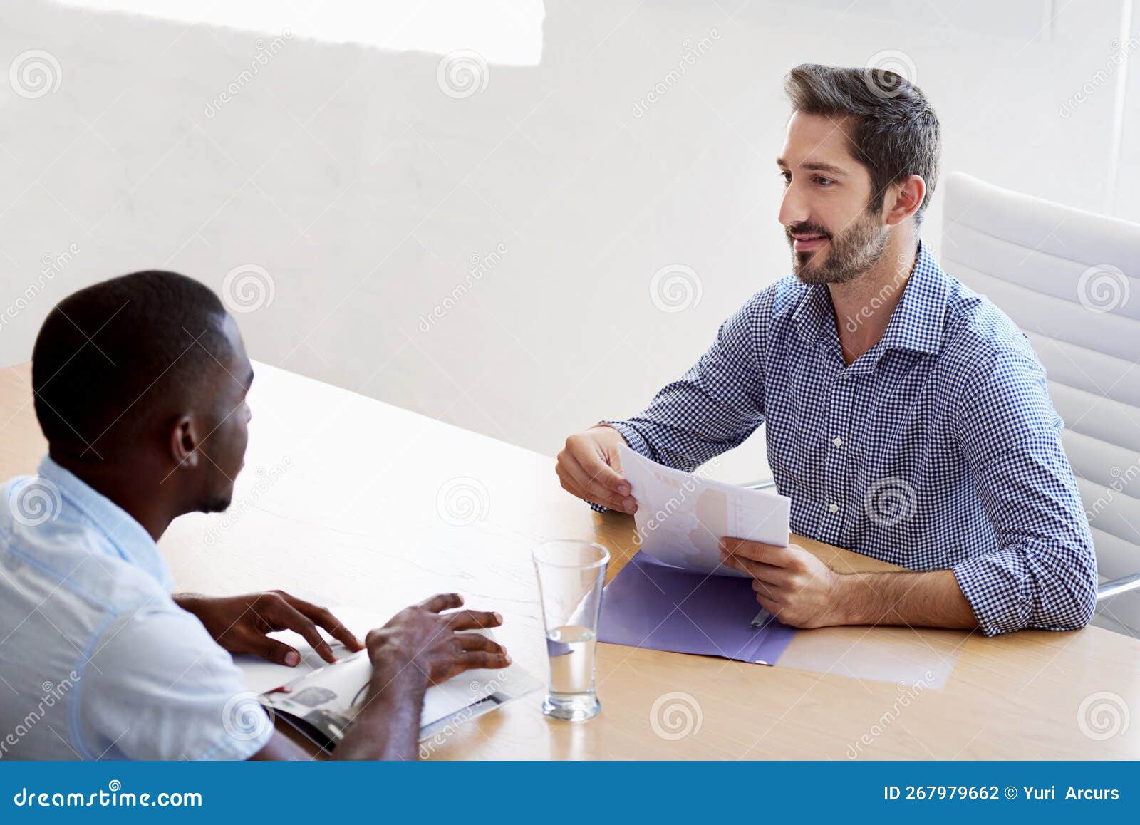 Interview in Progress...a Businessman Interviewing a Job Applicant in ...