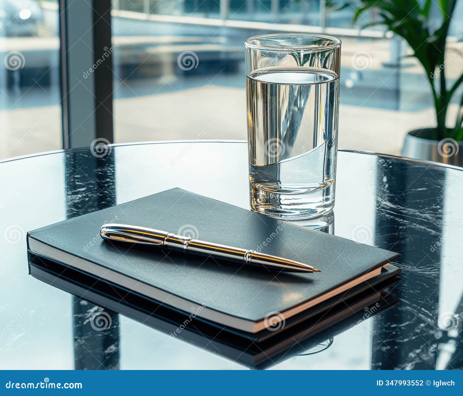Interview Table Setup with Glass of Water, Notebook, and Pen Stock ...