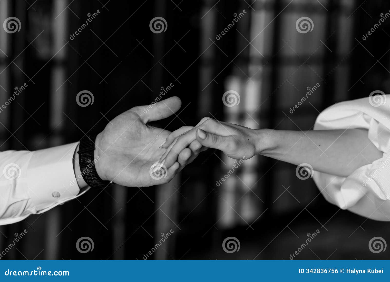 Intimate Connection: a Moment of Hands Crossing in Black and White ...