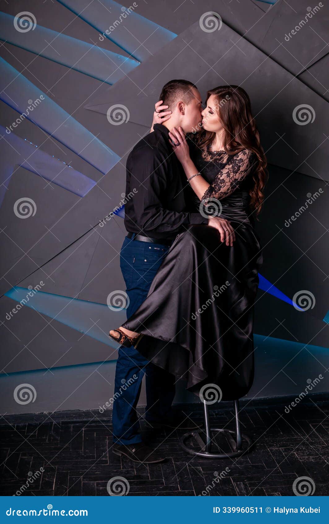 Intimate Embrace Against a Modern Backdrop Stock Image - Image of ...