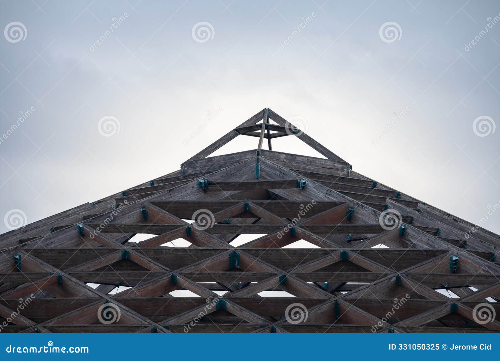 An Intricate Wooden Framework with Triangular Beams Showcases ...