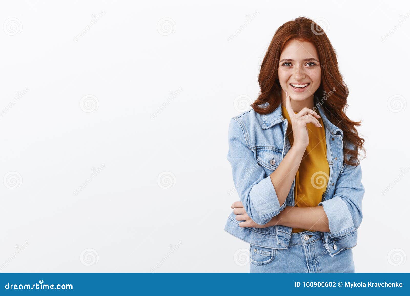 Intrigued Good Looking Redhead Modern Woman In Denim Jacket Touch Chin