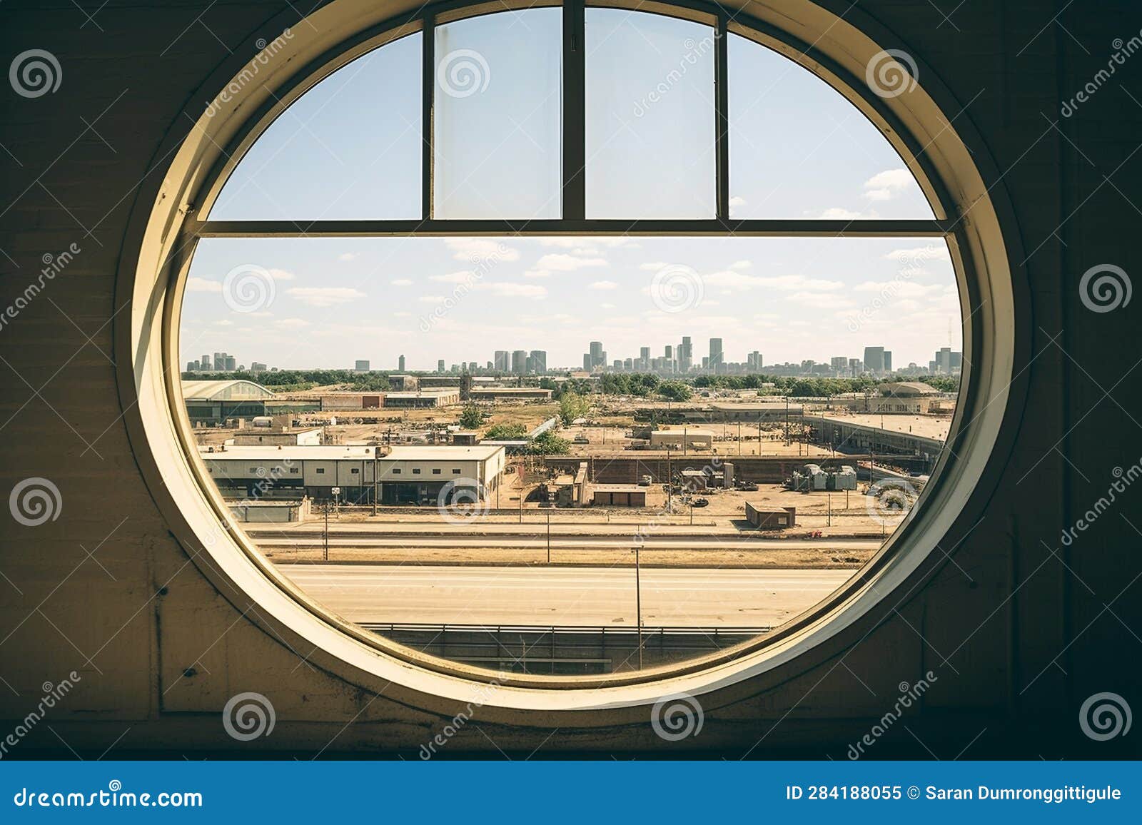 Overlooking a Bustling Manufacturing Plant through a Circular Window ...