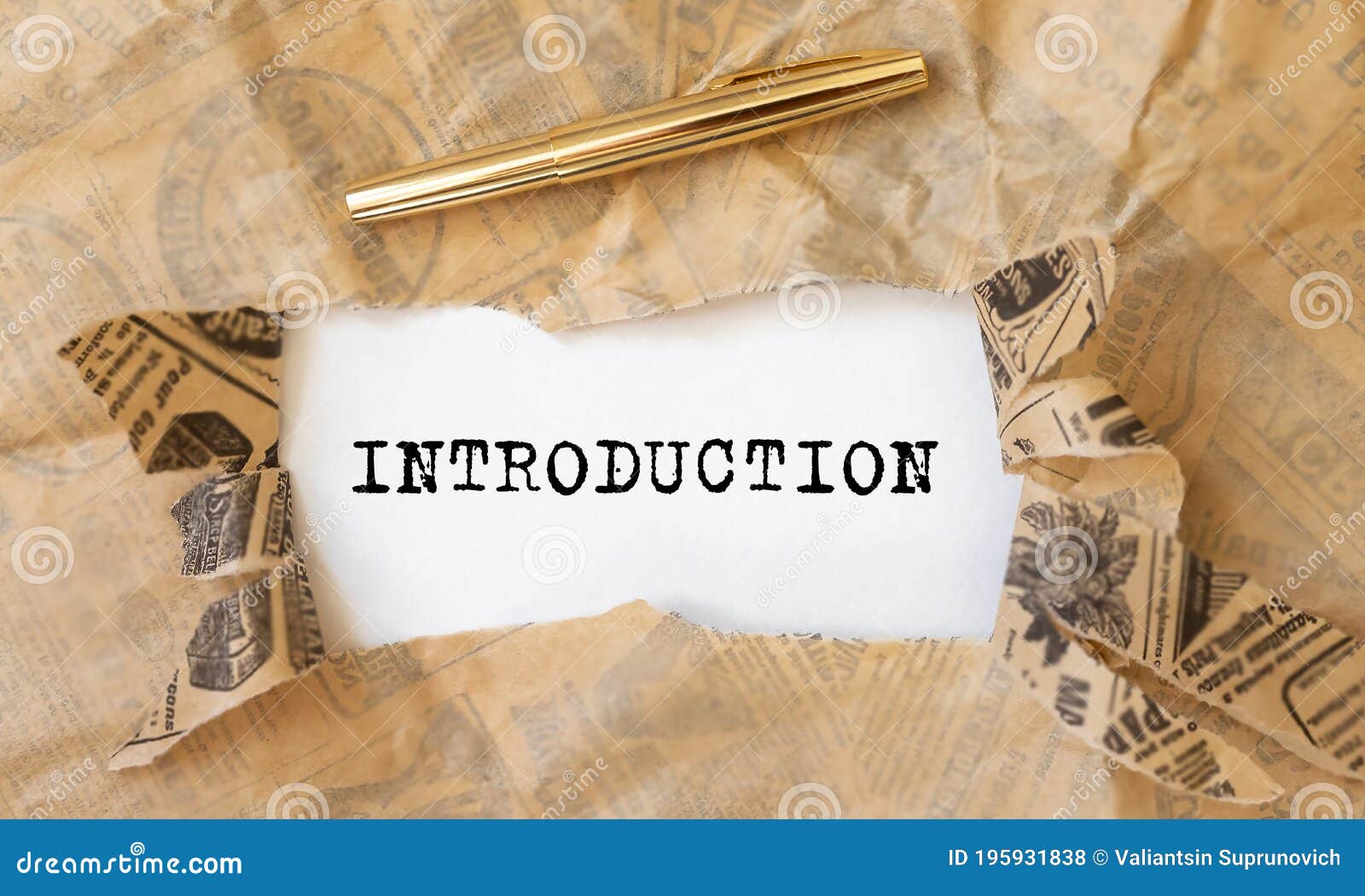Introduction Word on Paper through Torn Craft Paper Stock Photo - Image ...