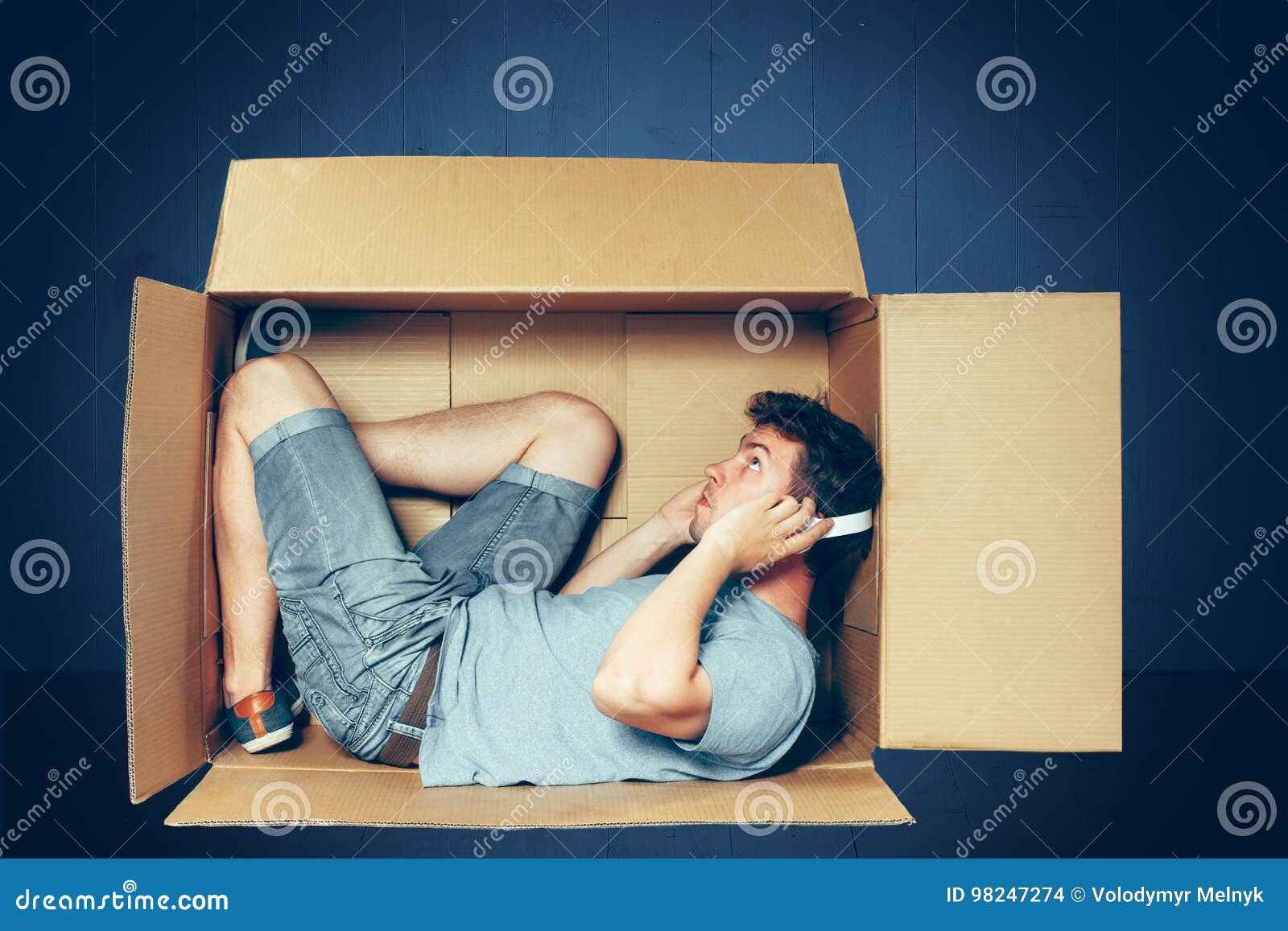 Introvert Concept. the Man Sitting Inside Box and Working with Laptop ...