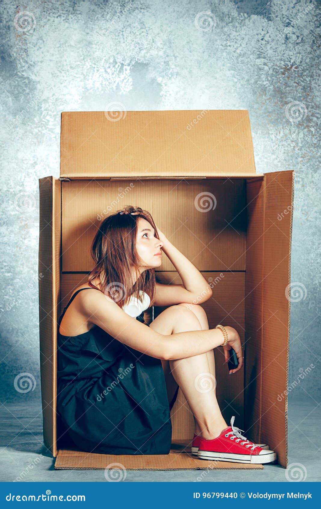 Introvert Concept. Woman Sitting Inside Box and Working with Phone ...