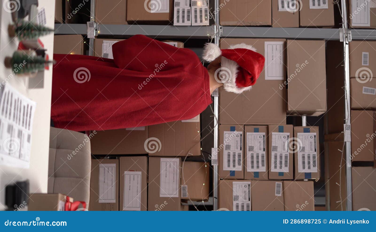 Inventory Manager Preparing a Small Cardboard Boxes for Postage Working ...