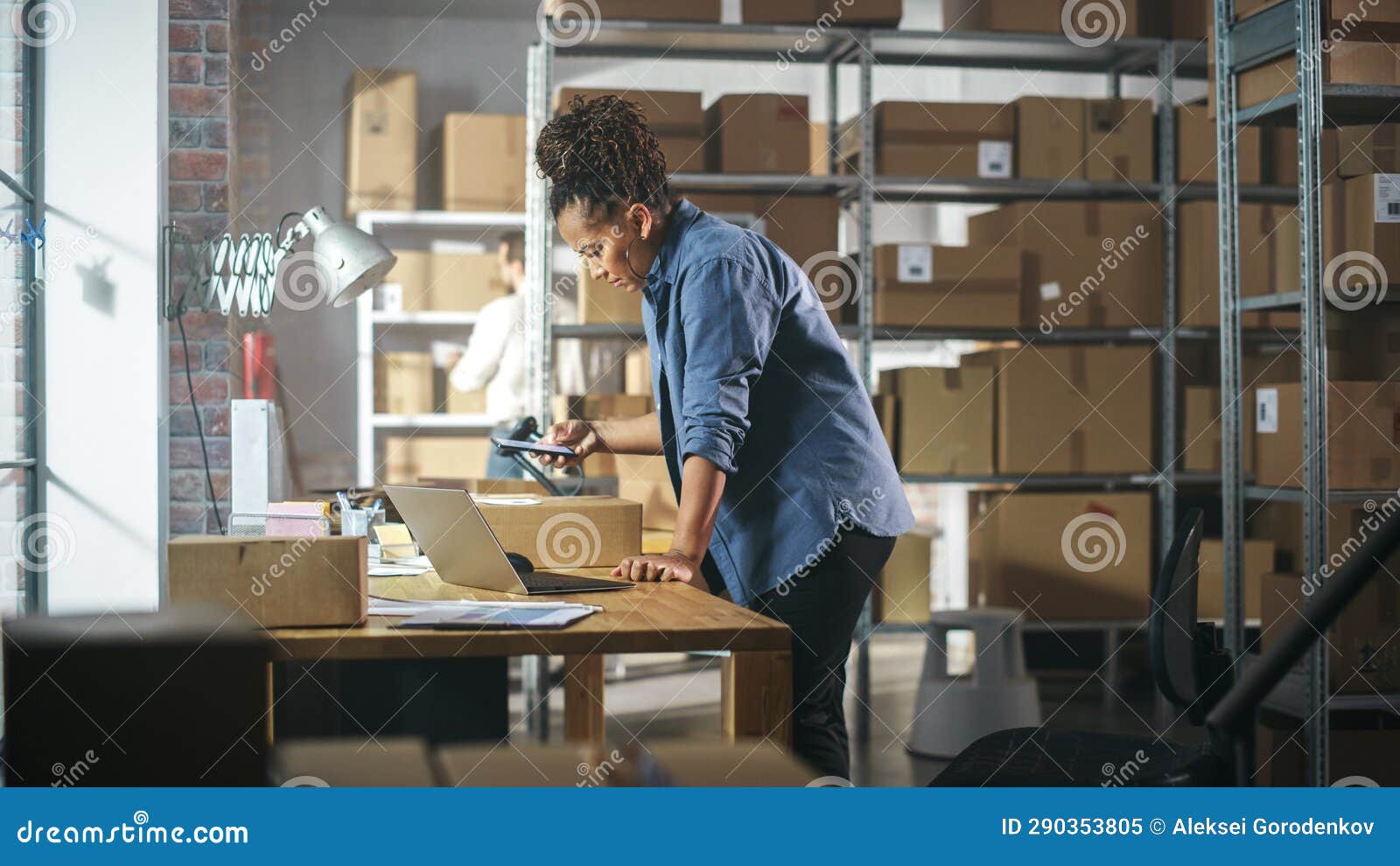Inventory Manager Using Smartphone To Scan a Barcode on Parcel ...