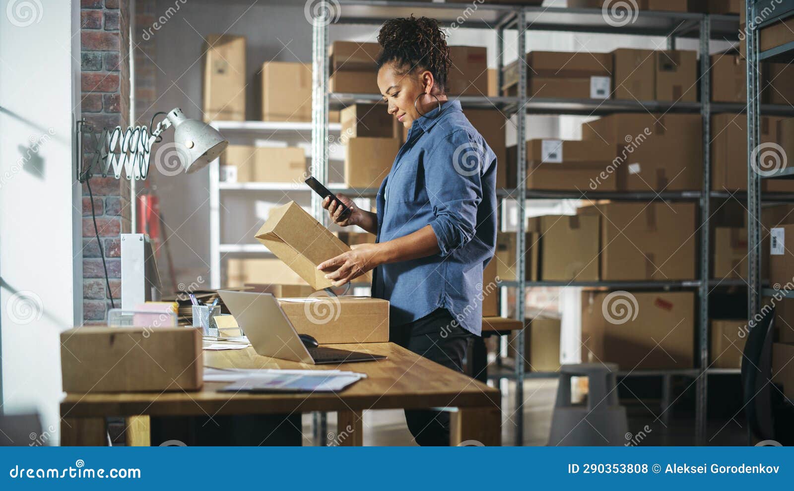 Inventory Manager Using Smartphone To Scan a Barcode on Parcel ...