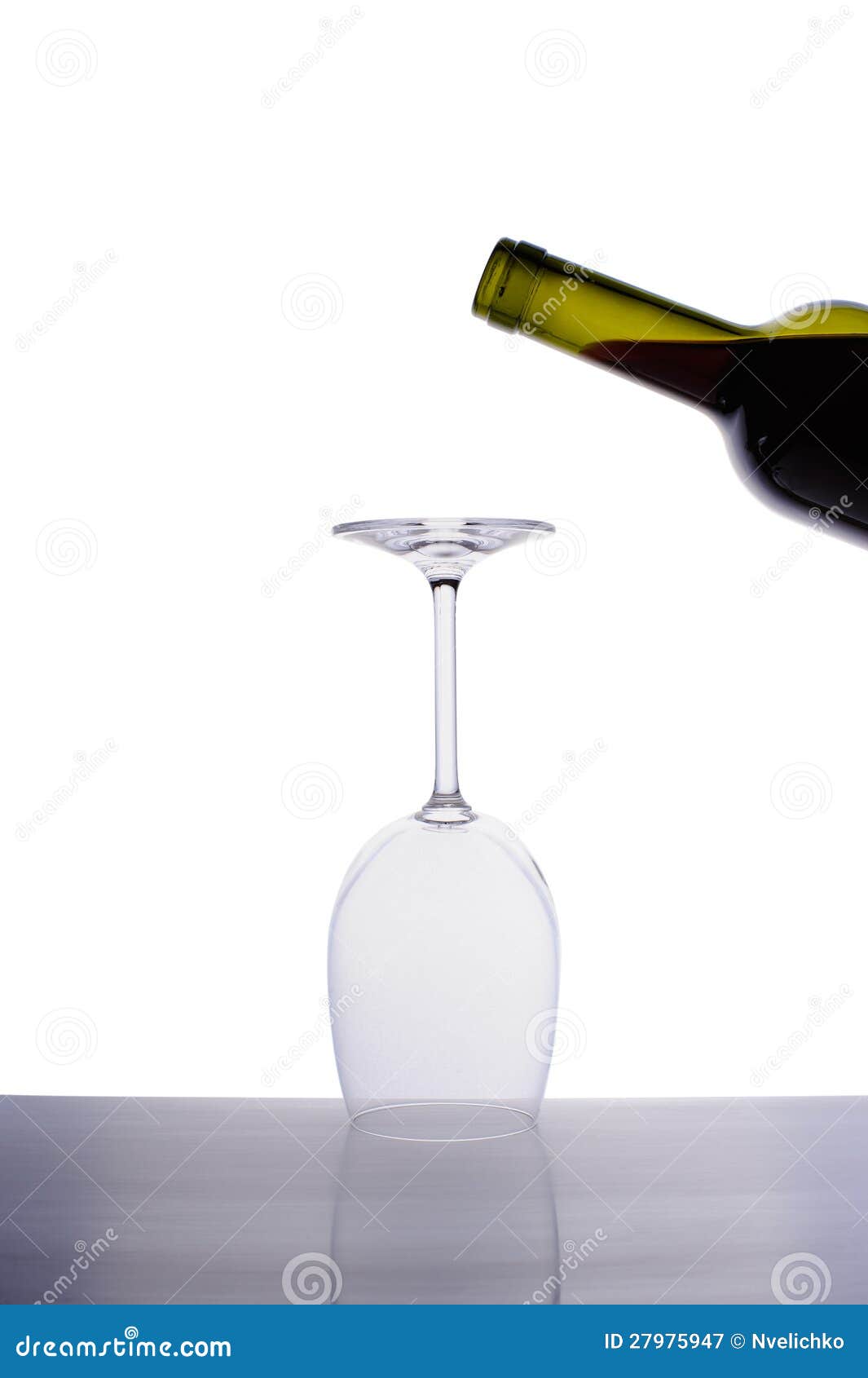 Inverted Empty Wine Glass And Bottle Of Red Wine Picture. Image: 27975947