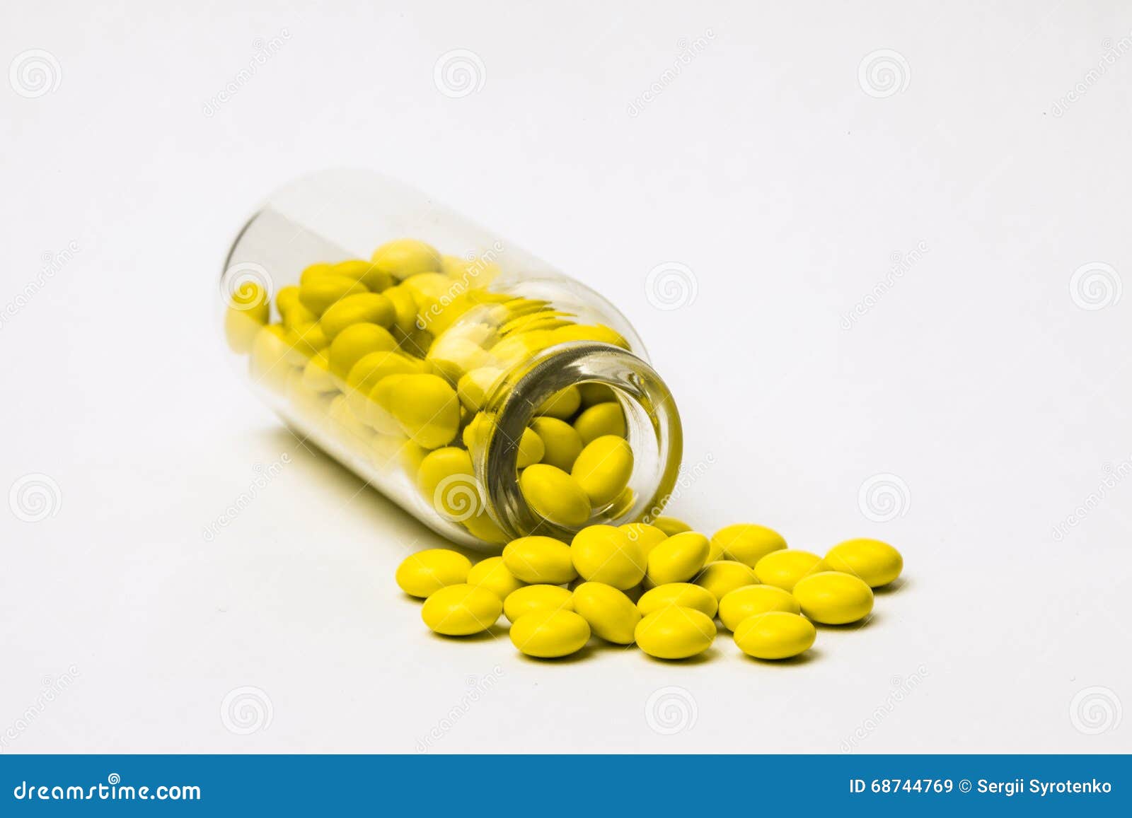 Inverted Glass Vial with Scattered Small Yellow Pills Stock Image ...