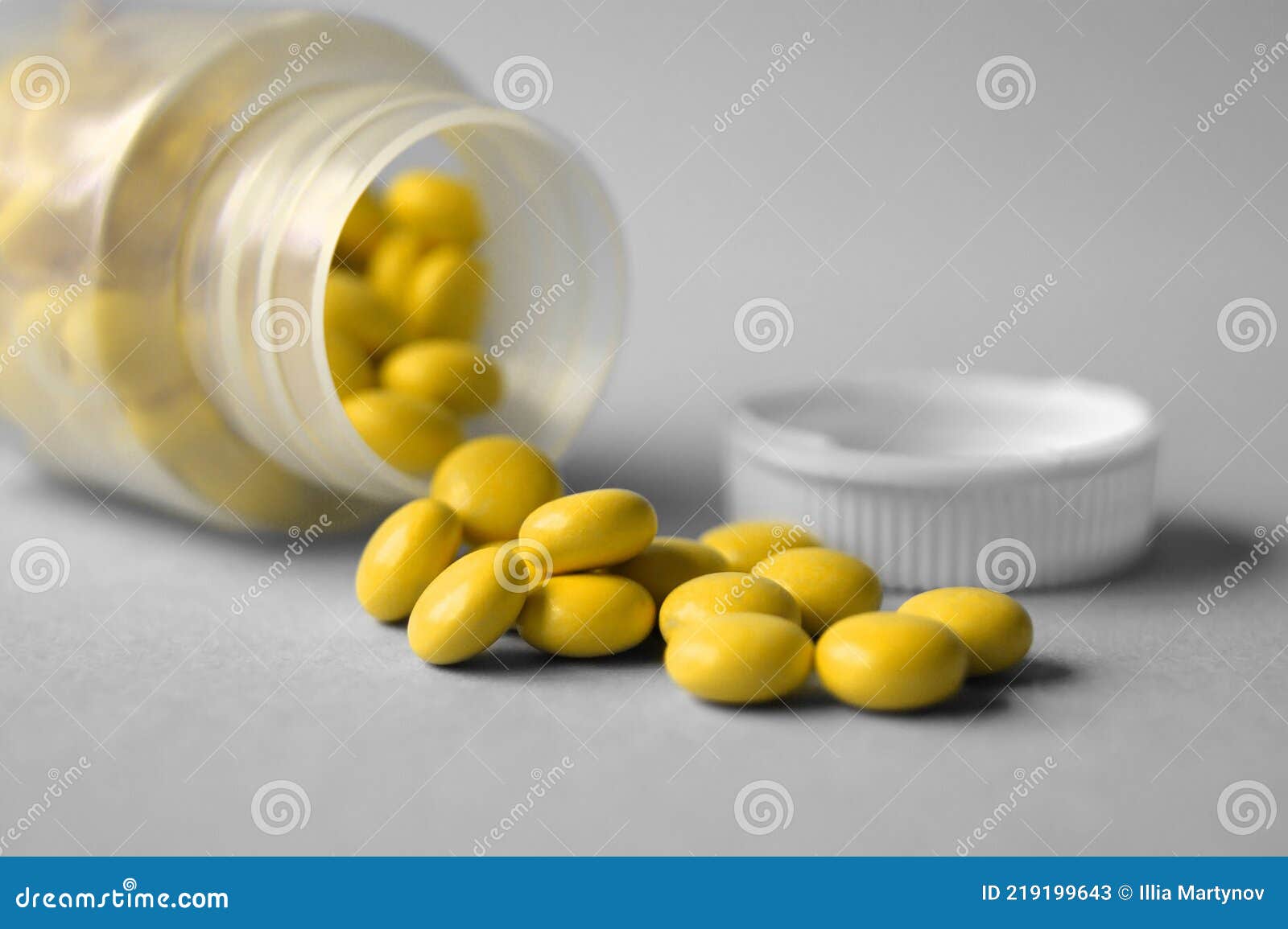 Inverted Jar with Yellow Pills on a Gray Background Stock Image - Image ...