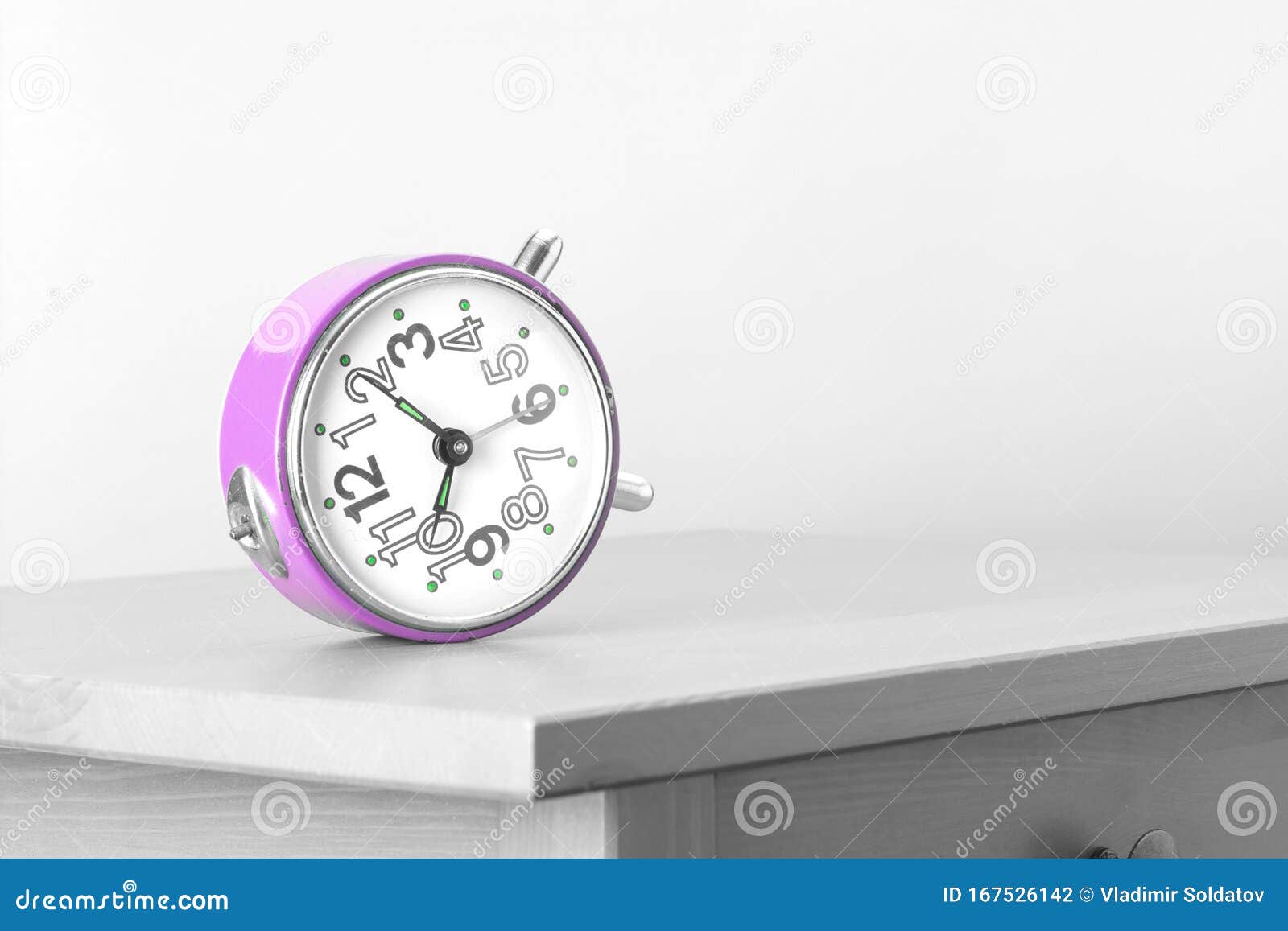 Inverted Retro Alarm Clock Lying on the Bedside Table Stock Photo ...