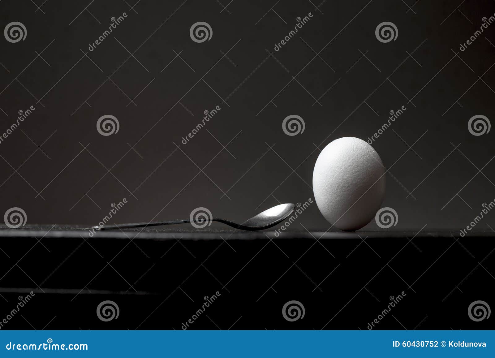 Inverted Upside Down Egg Stands on a Black Wooden Table Stock Photo ...
