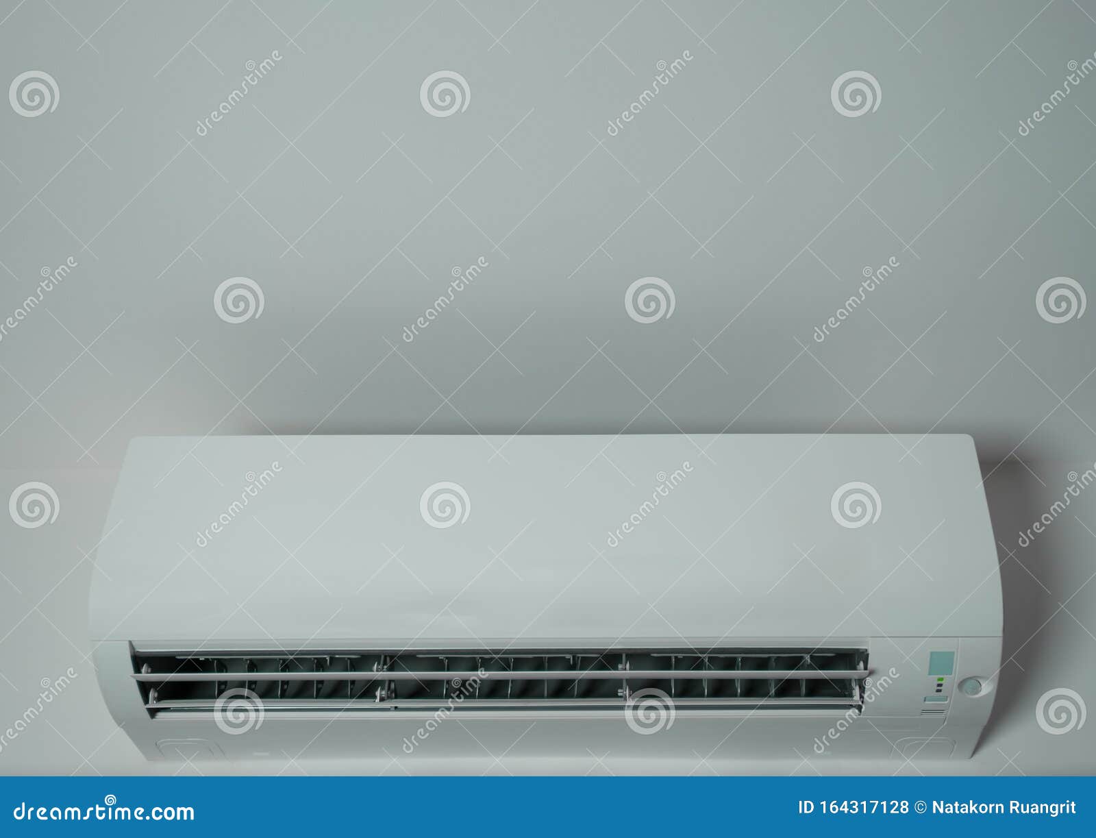 Inverter Air Conditioner with Motion Sensor System on Modern White Wall ...