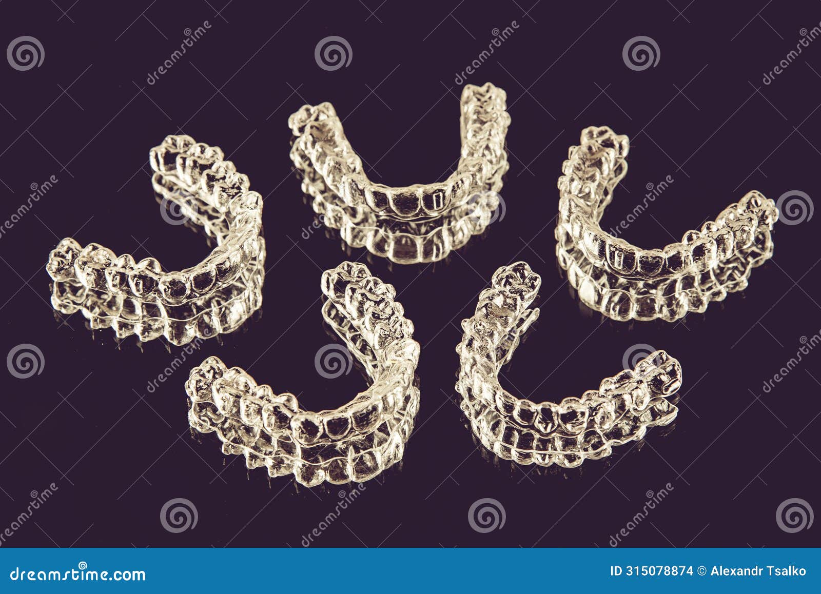 Invisible Aligners Teeth Retainers Lie on the Mirror Stock Photo ...