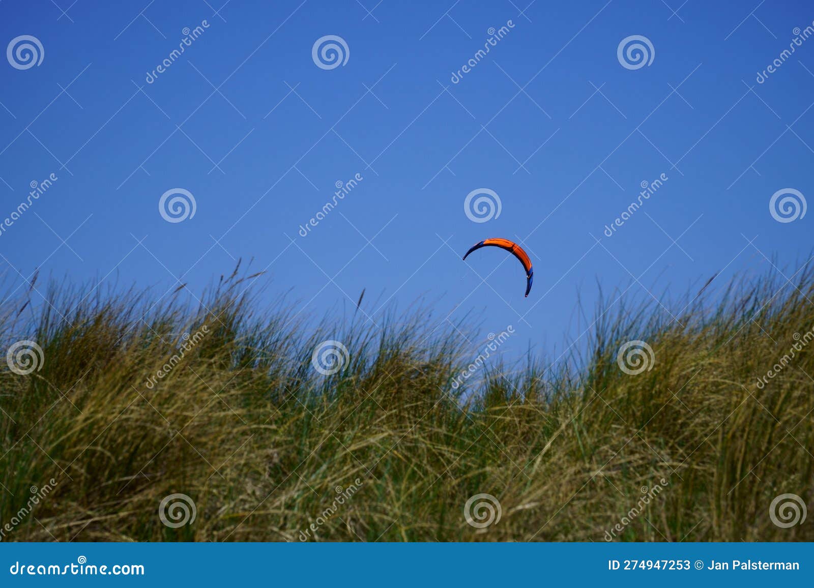The Invisible Kite Surfer Behind the Dunes. Stock Image - Image of lots ...