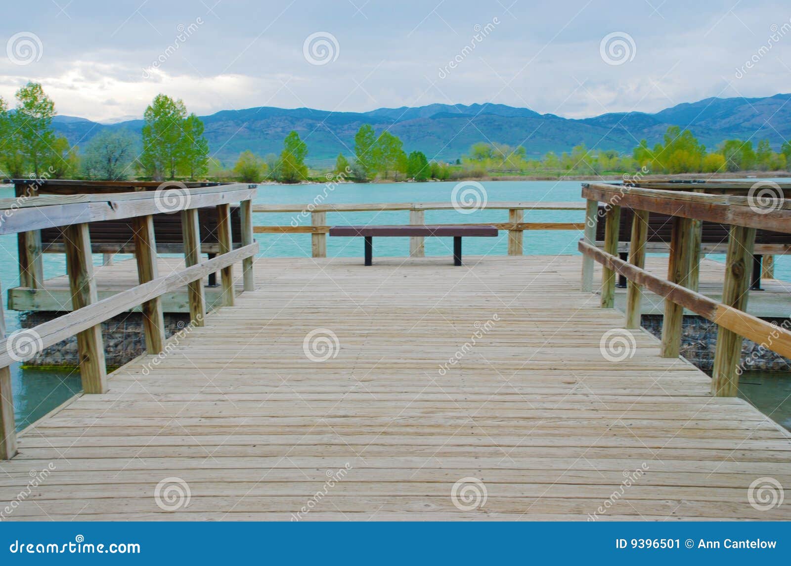 Inviting Lake Pier with View of Purple Mountains Stock Image - Image of ...